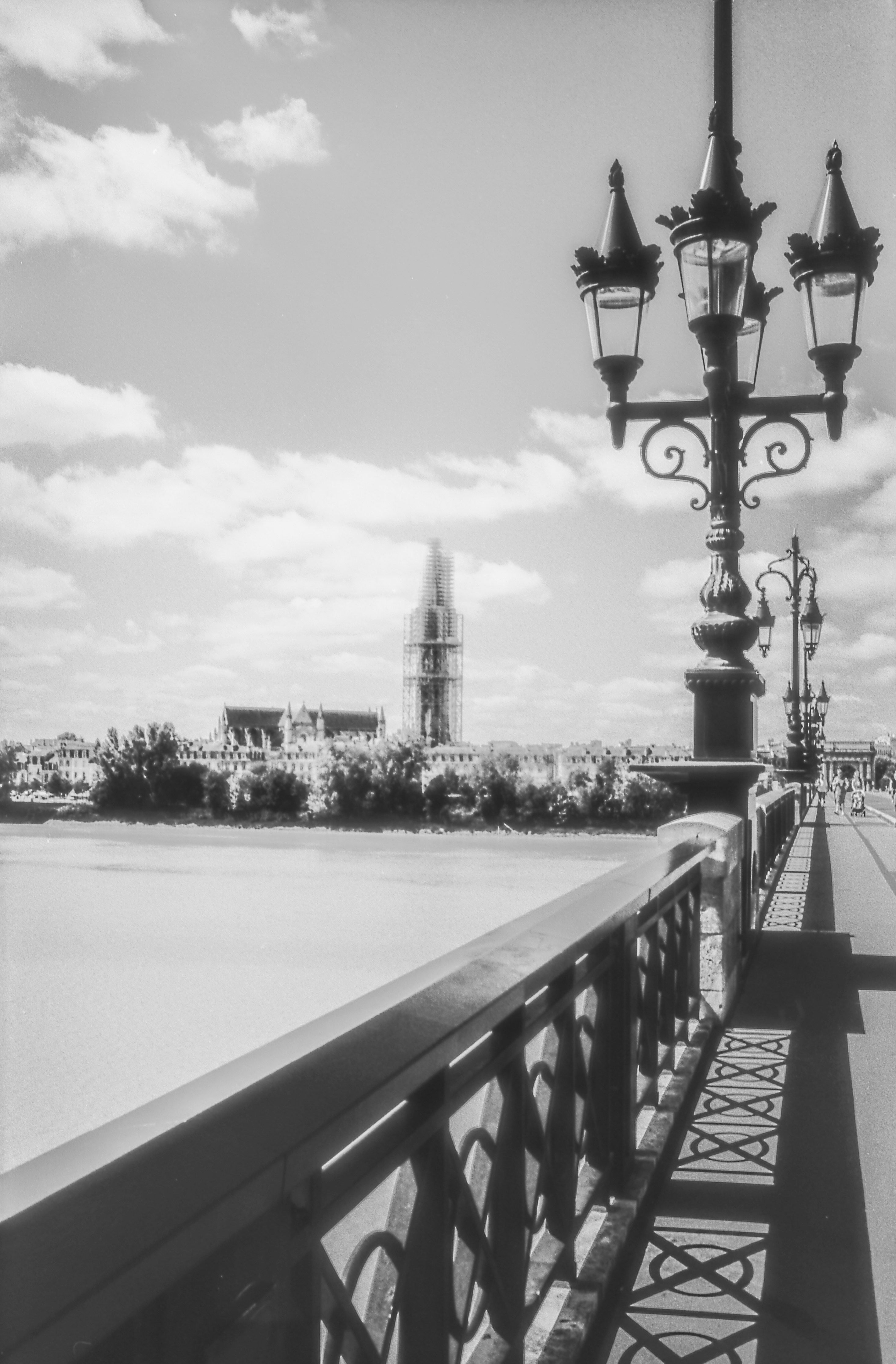 Lamp-lit Riverside: A Quiet Walk Along the Iron Railing