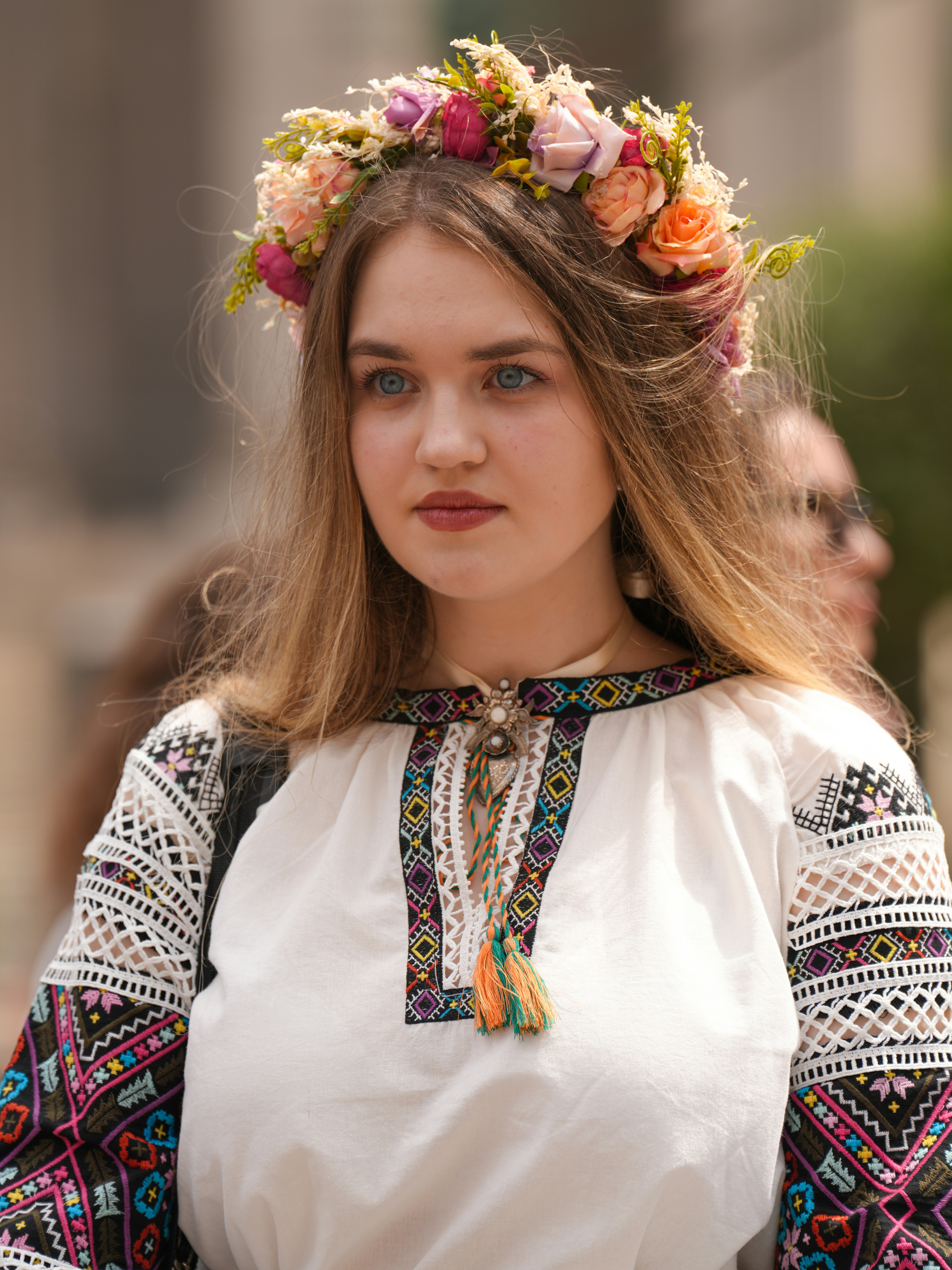 Floral Crown and Embroidered Garb: A Portrait of Quiet Confidence