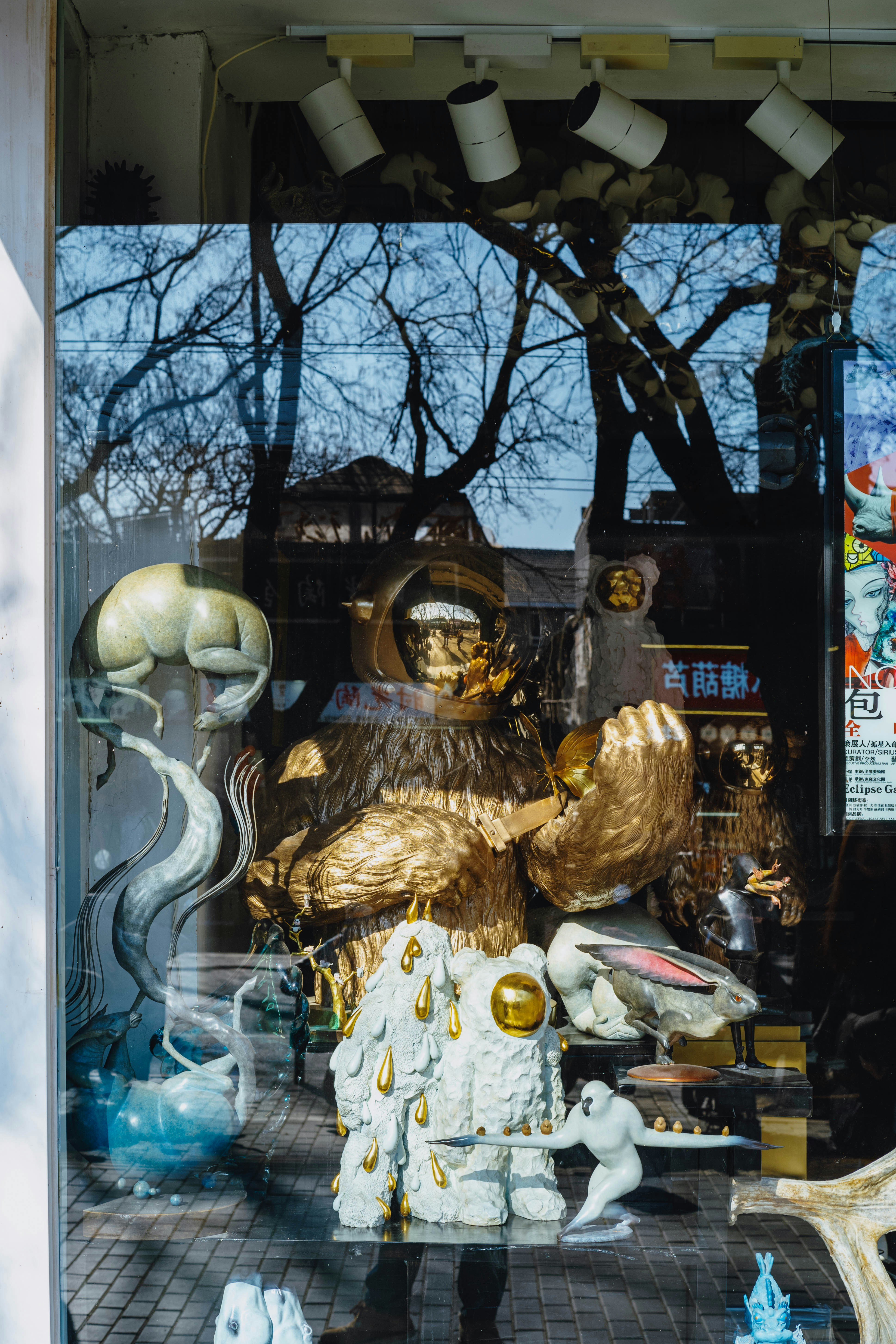 Reflections and Fantastical Sculptures in a Glass Shop Window