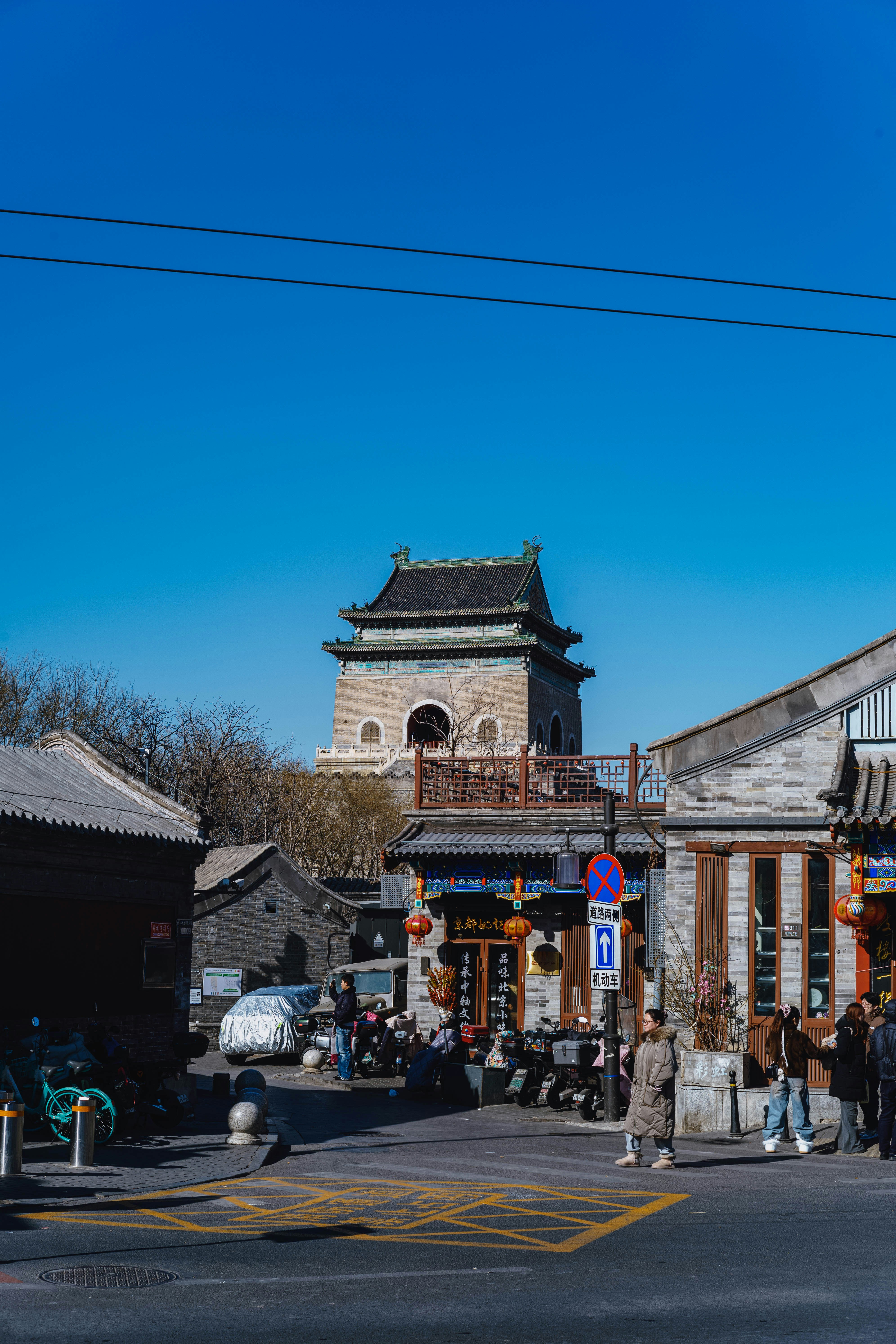 Temple Gate Overlook: Street Scene Framed by a Historic Tower