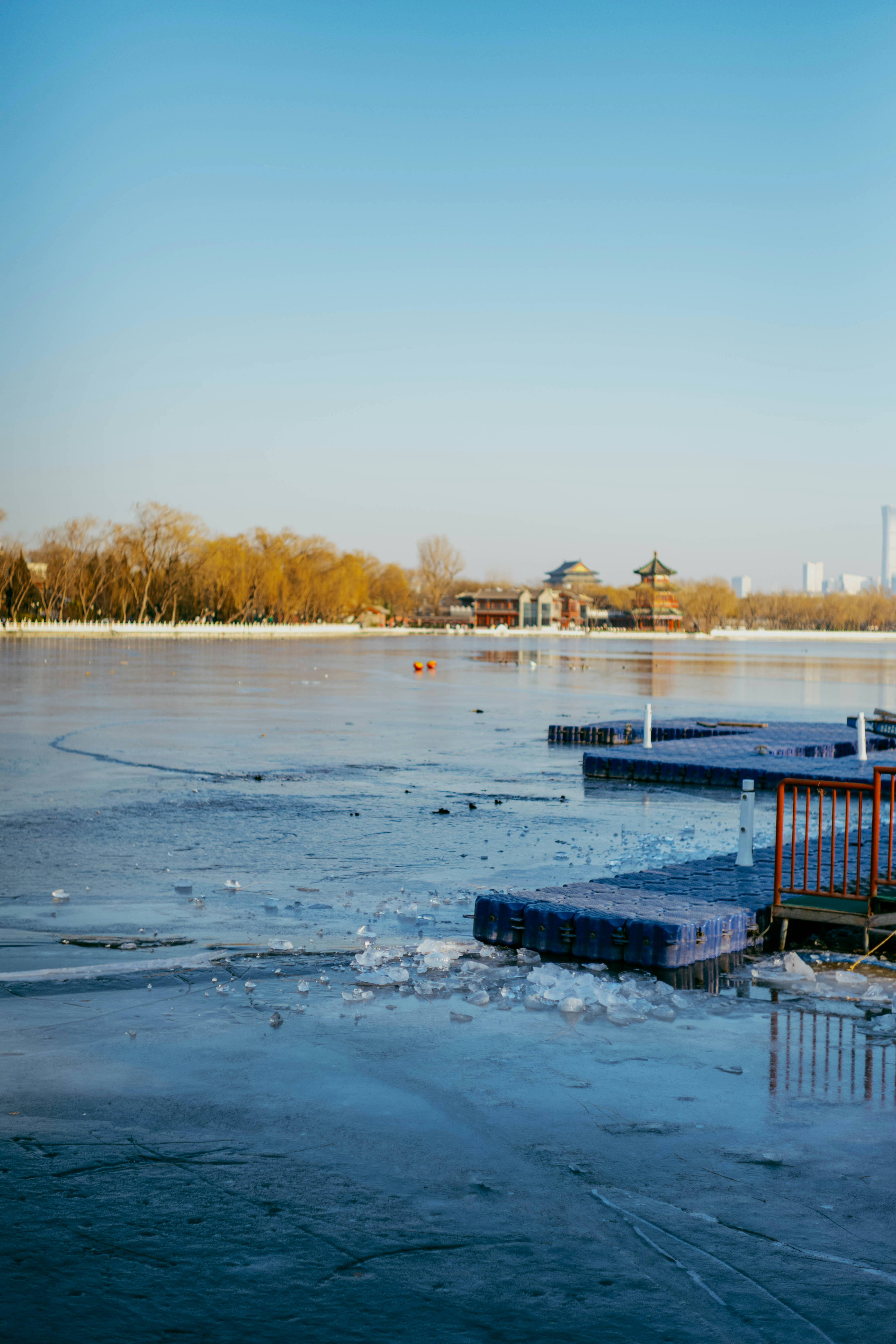 Frozen Lakefront at Dusk: A Quiet Moment by the Pier