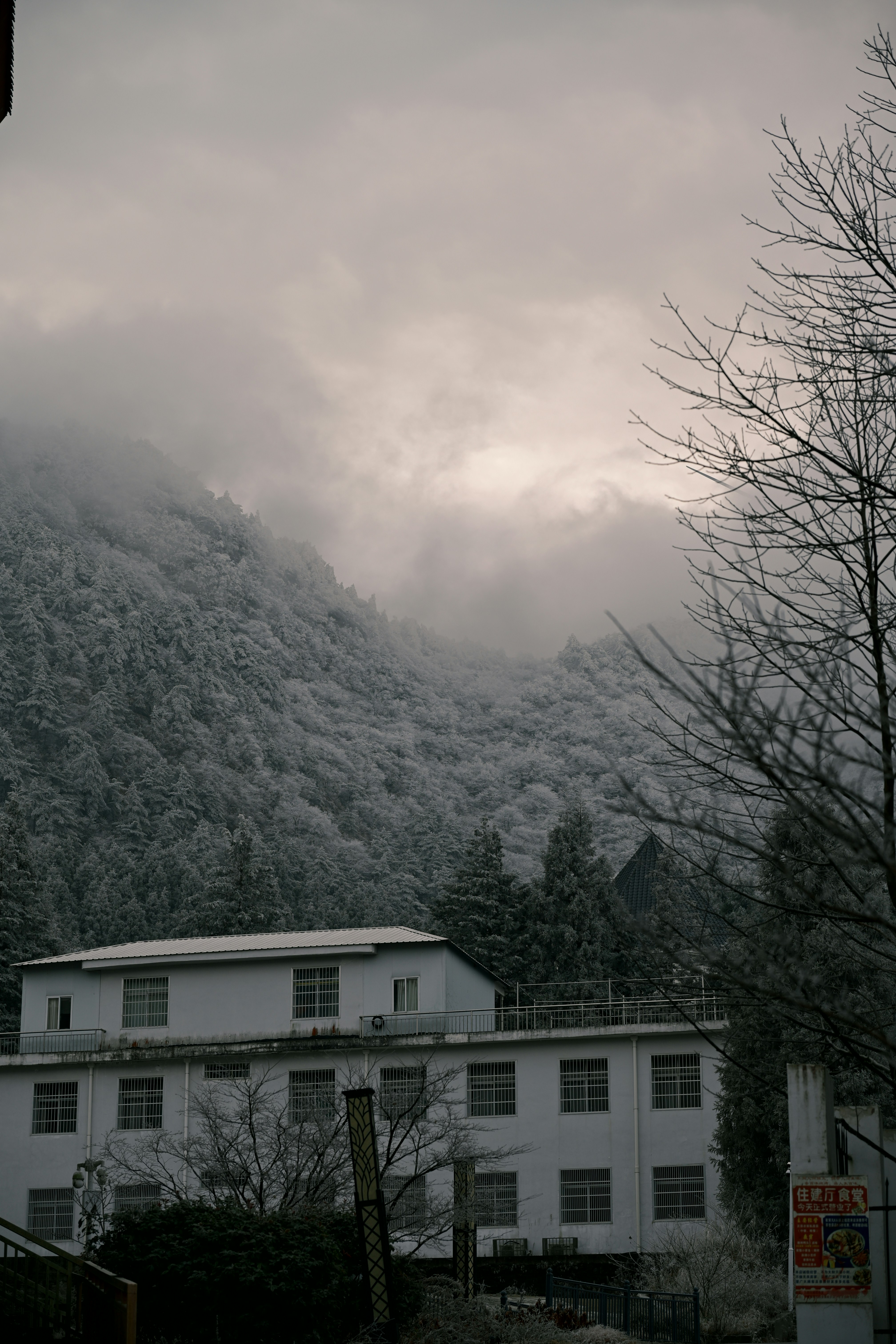 Industrial Campus Beneath a Snow-Kissed Ridge