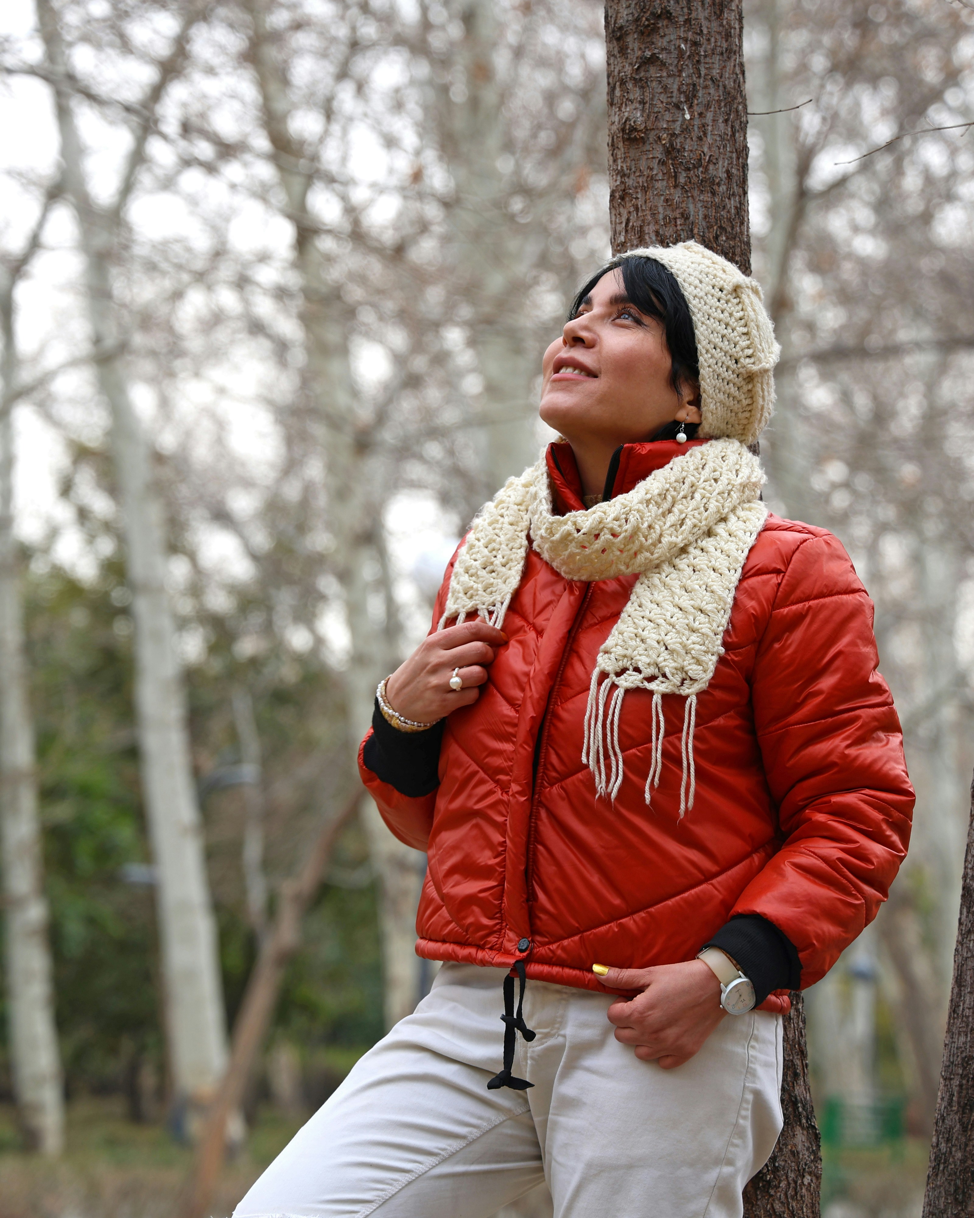 Red Winter Echo: A Portrait Amid Bare Trees