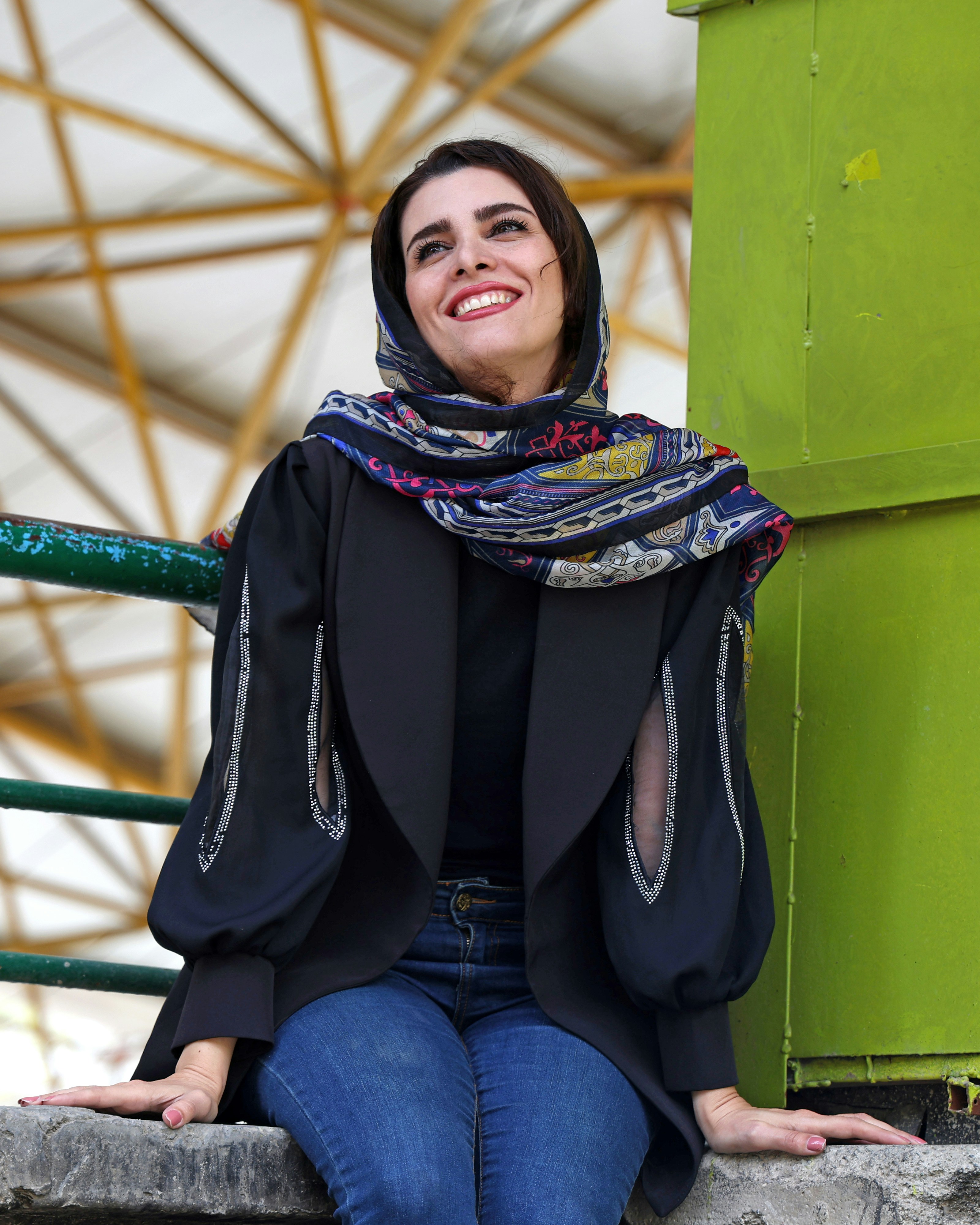 Outdoor modeling photo of a young female model in one of Tehran's parks .