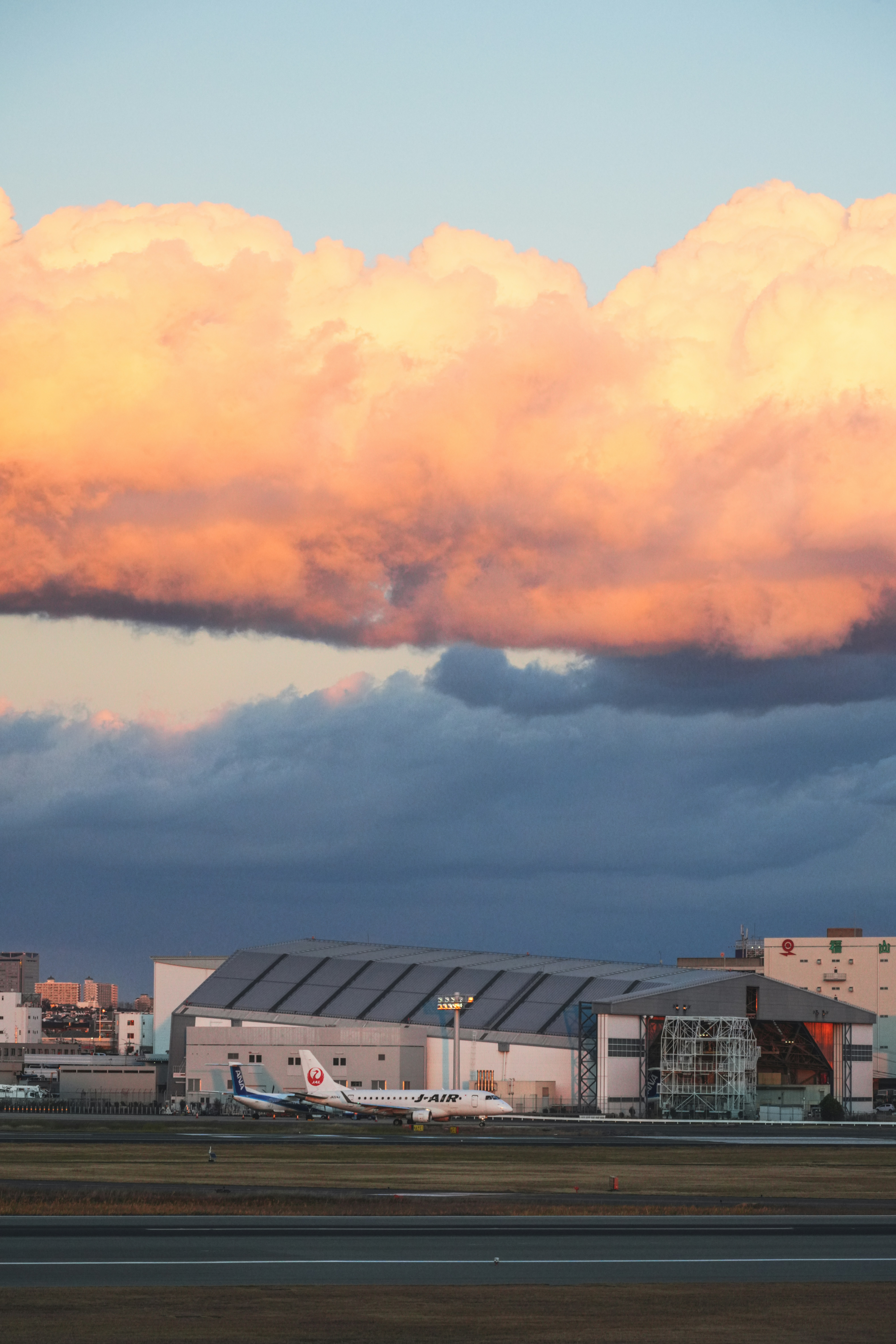 Sunlit Clouds Over a Quiet Runway