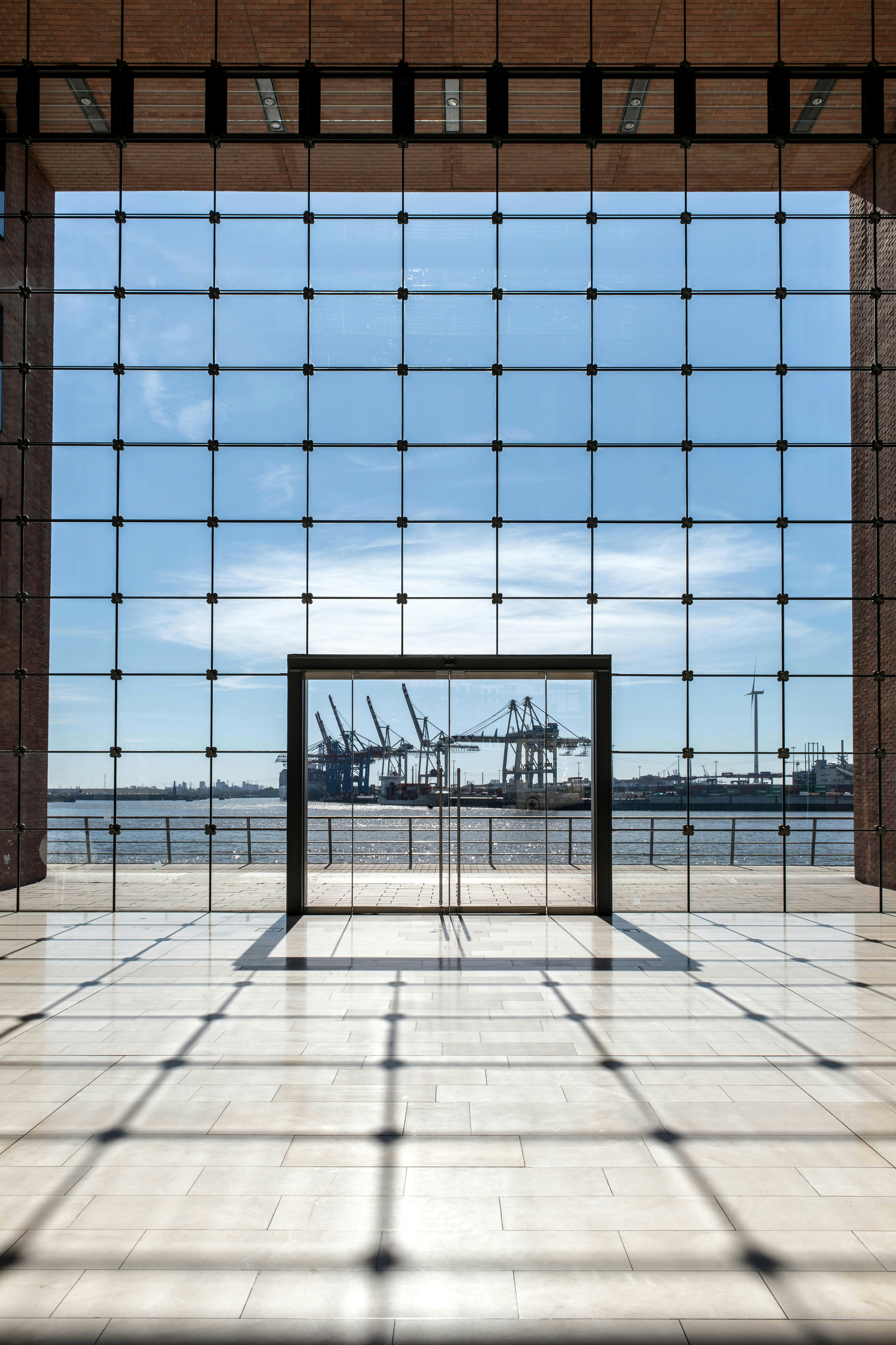 Framed Harbor Through a Grid of Steel and Sky