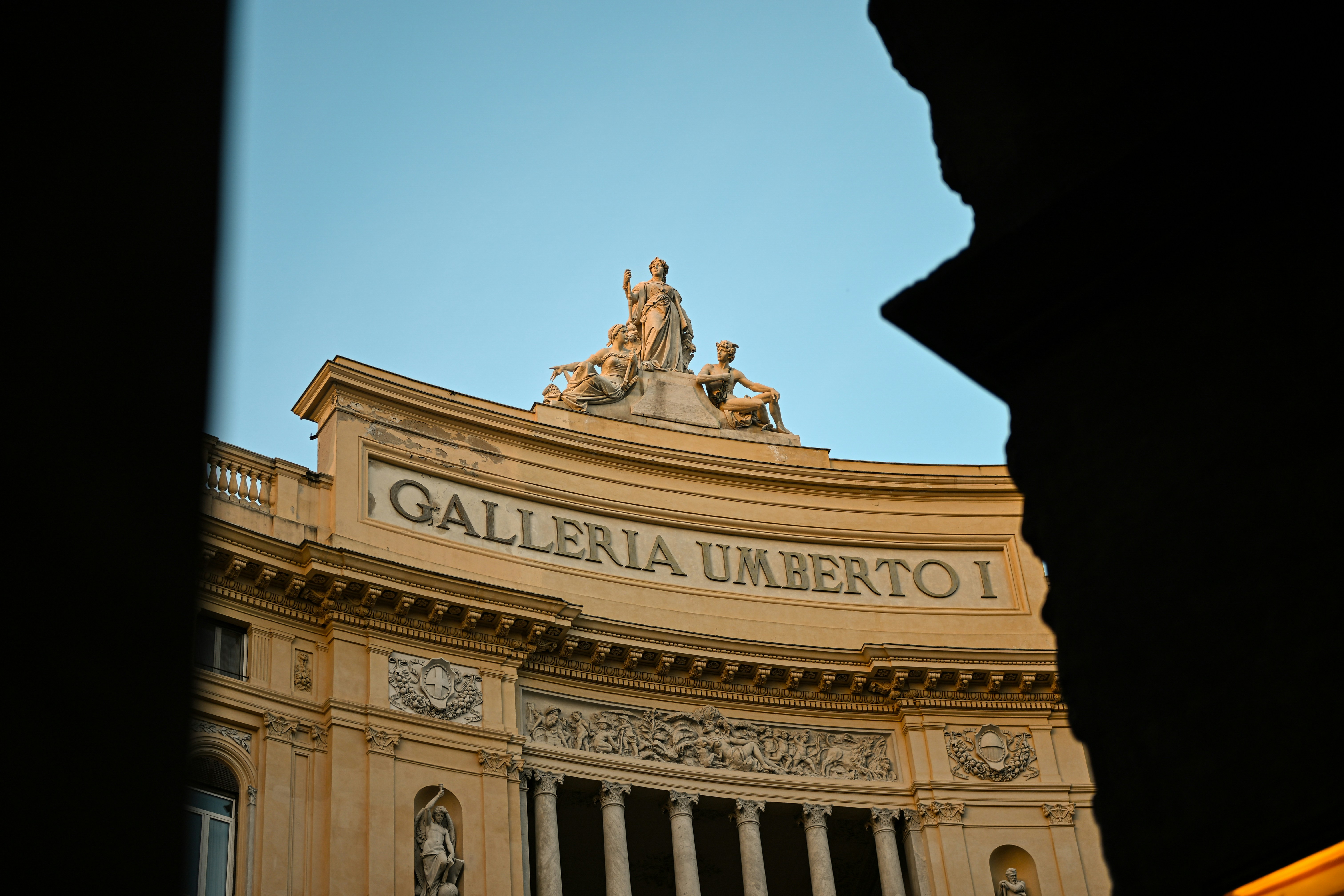 Architectural Triumph Framed: Galleria of Light Through a Narrow Aperture