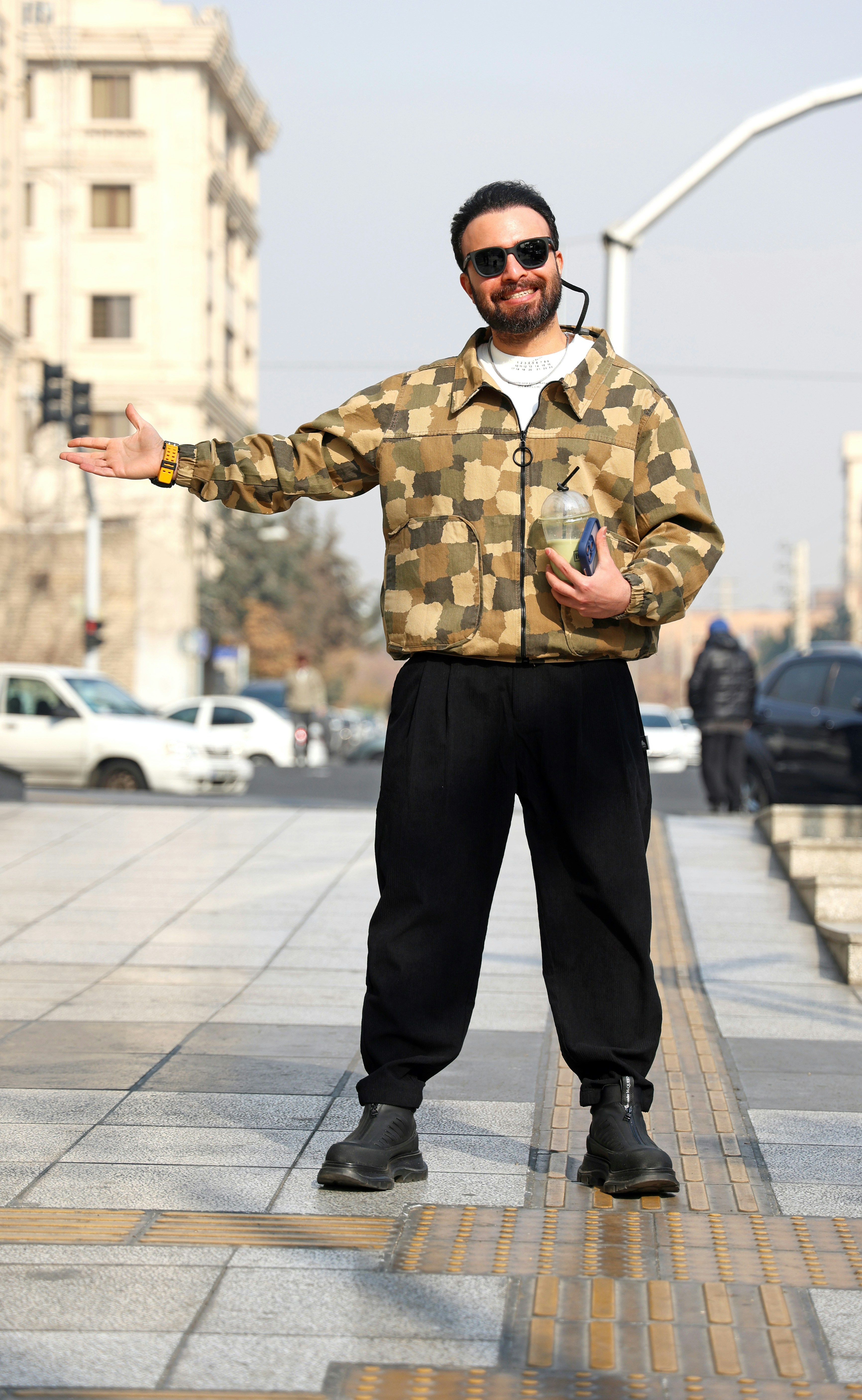 Outstretched Welcome: City Street Portrait in Camouflage Attire