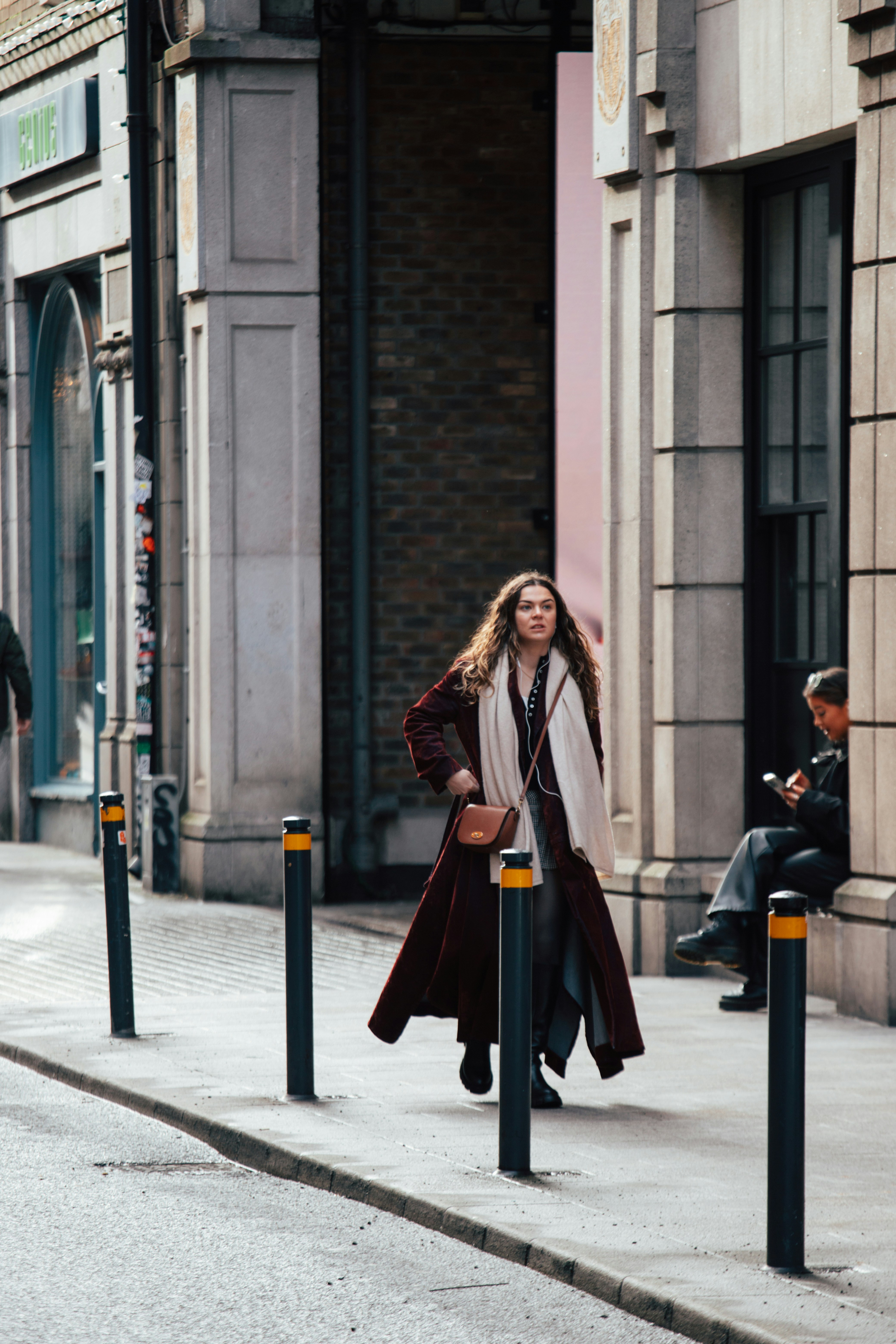 City Street Stride: A Buried-In-Style Moment Between Pillars