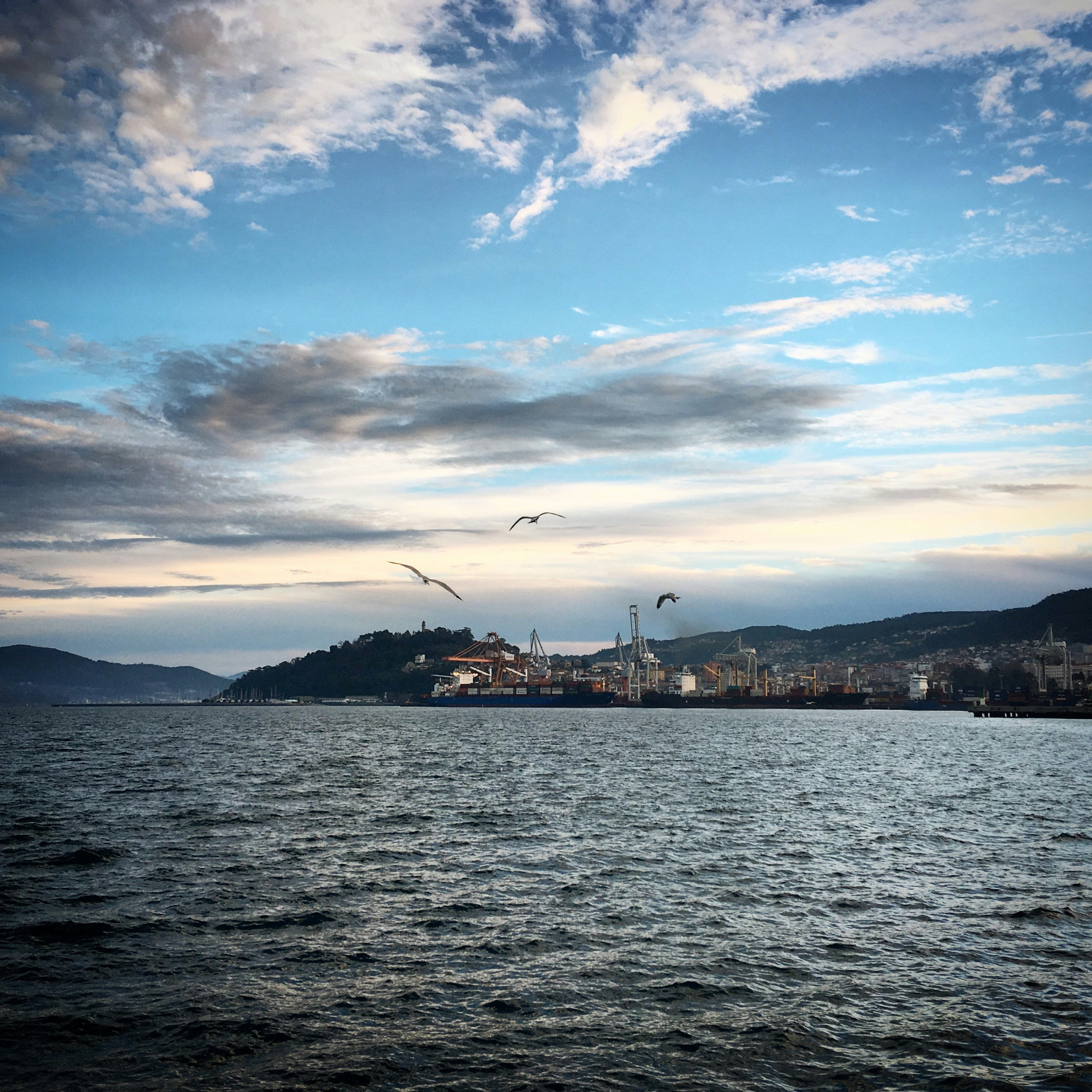 Harbor Edge at Dusk: Seascape Beneath a Brimming Sky