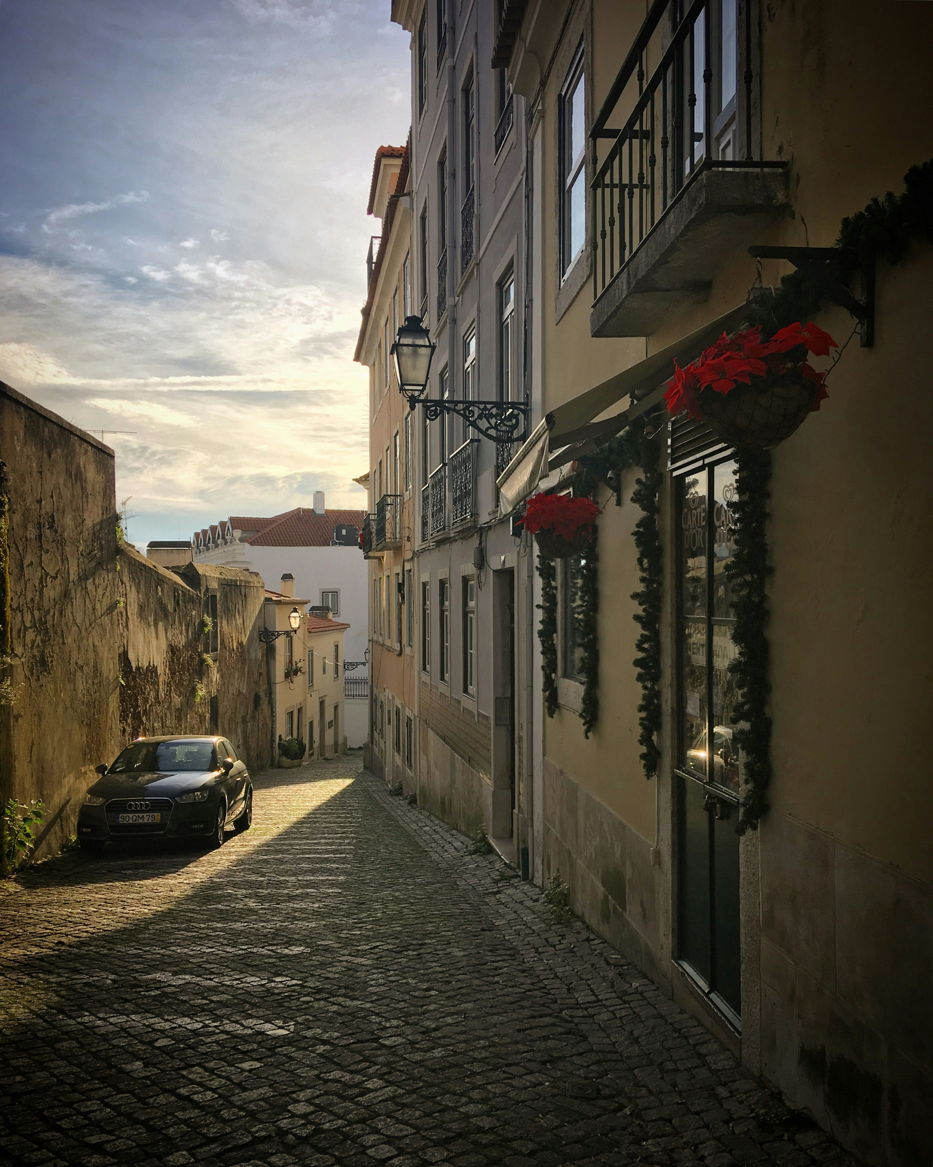 Sunlit Alleyway: A Quiet European Cobblestone Morning