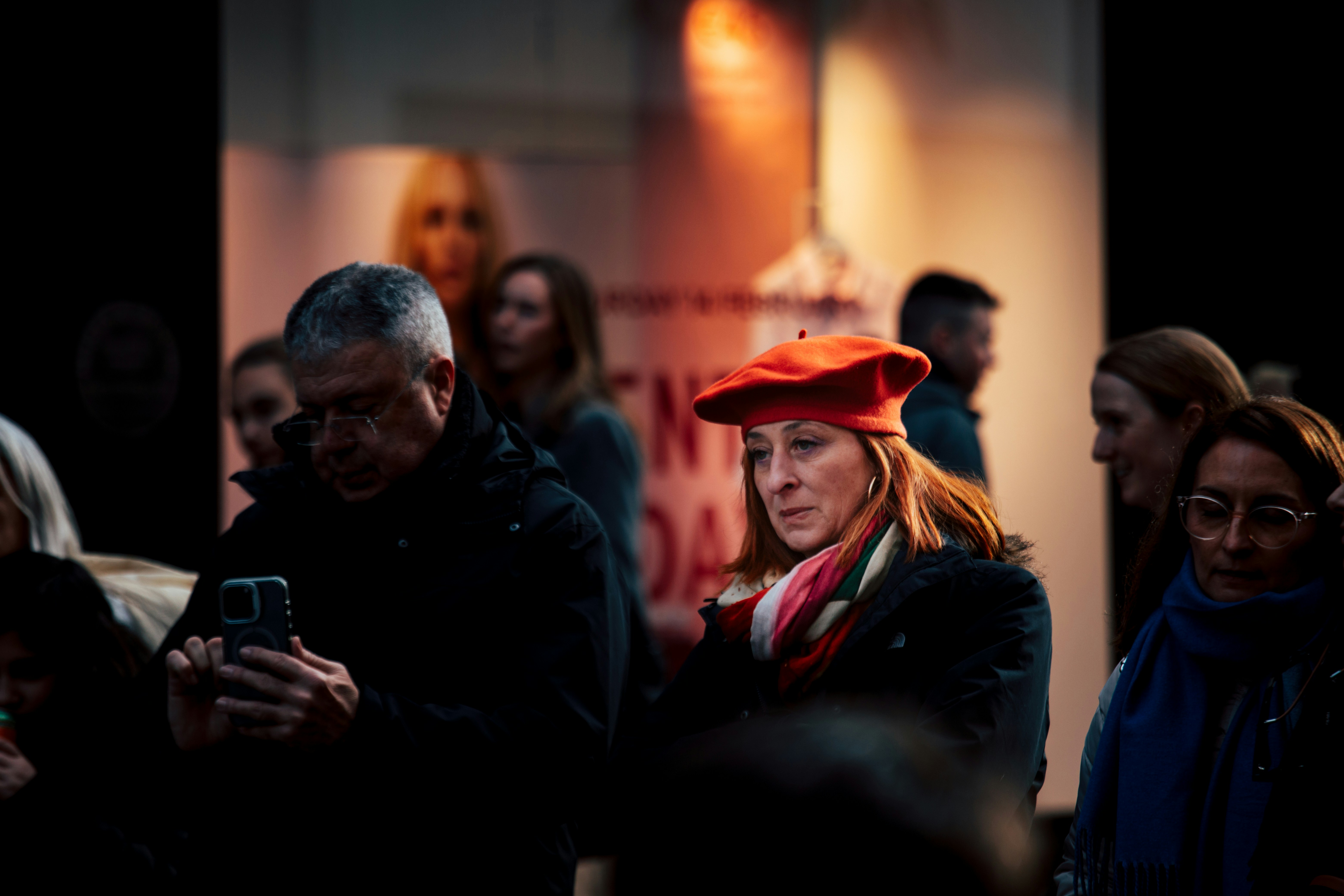 Red Beret Moment: A Quiet Gaze Among the Street Crowd