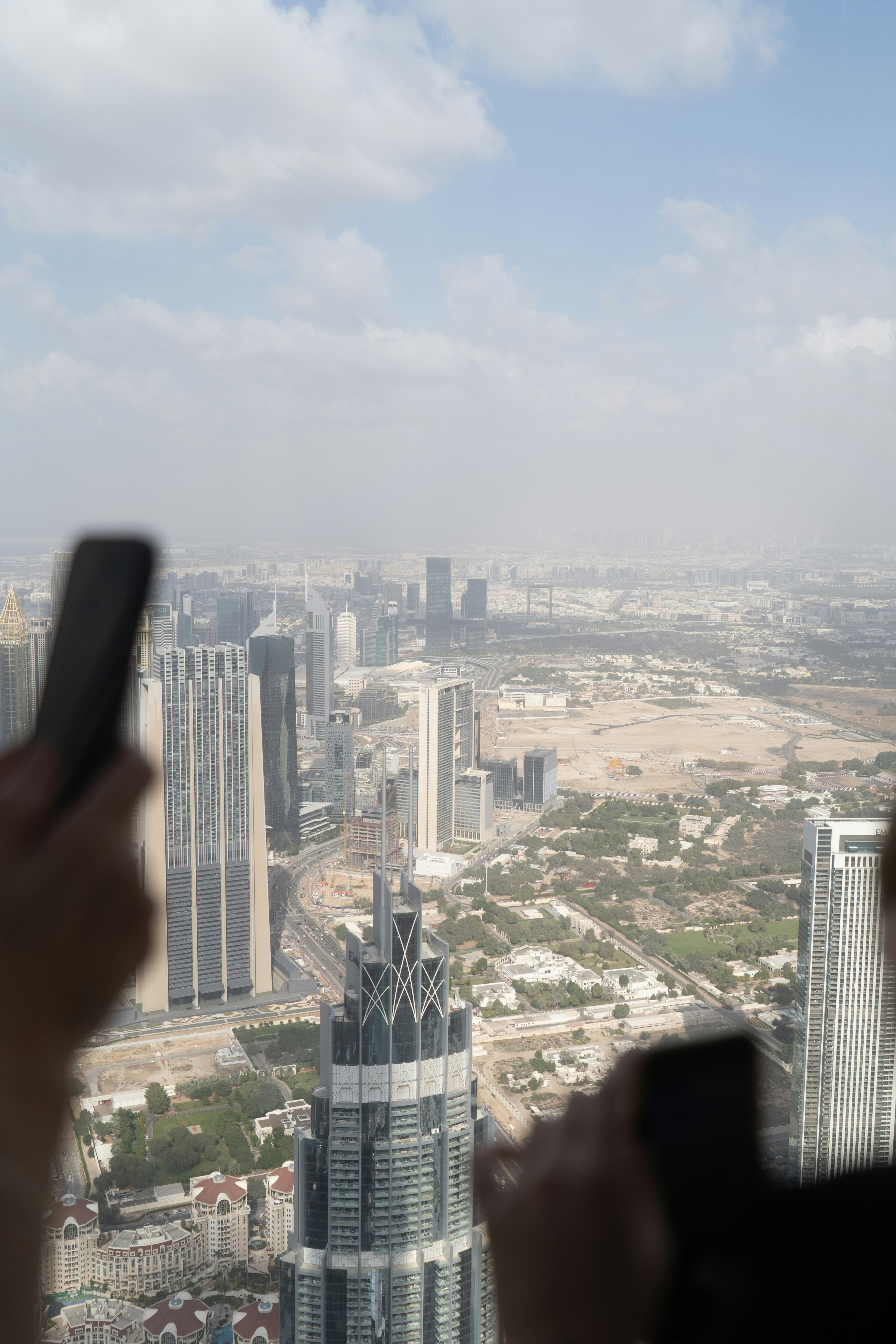 Cityscape from a High Rise: Fingers Framing the Sky