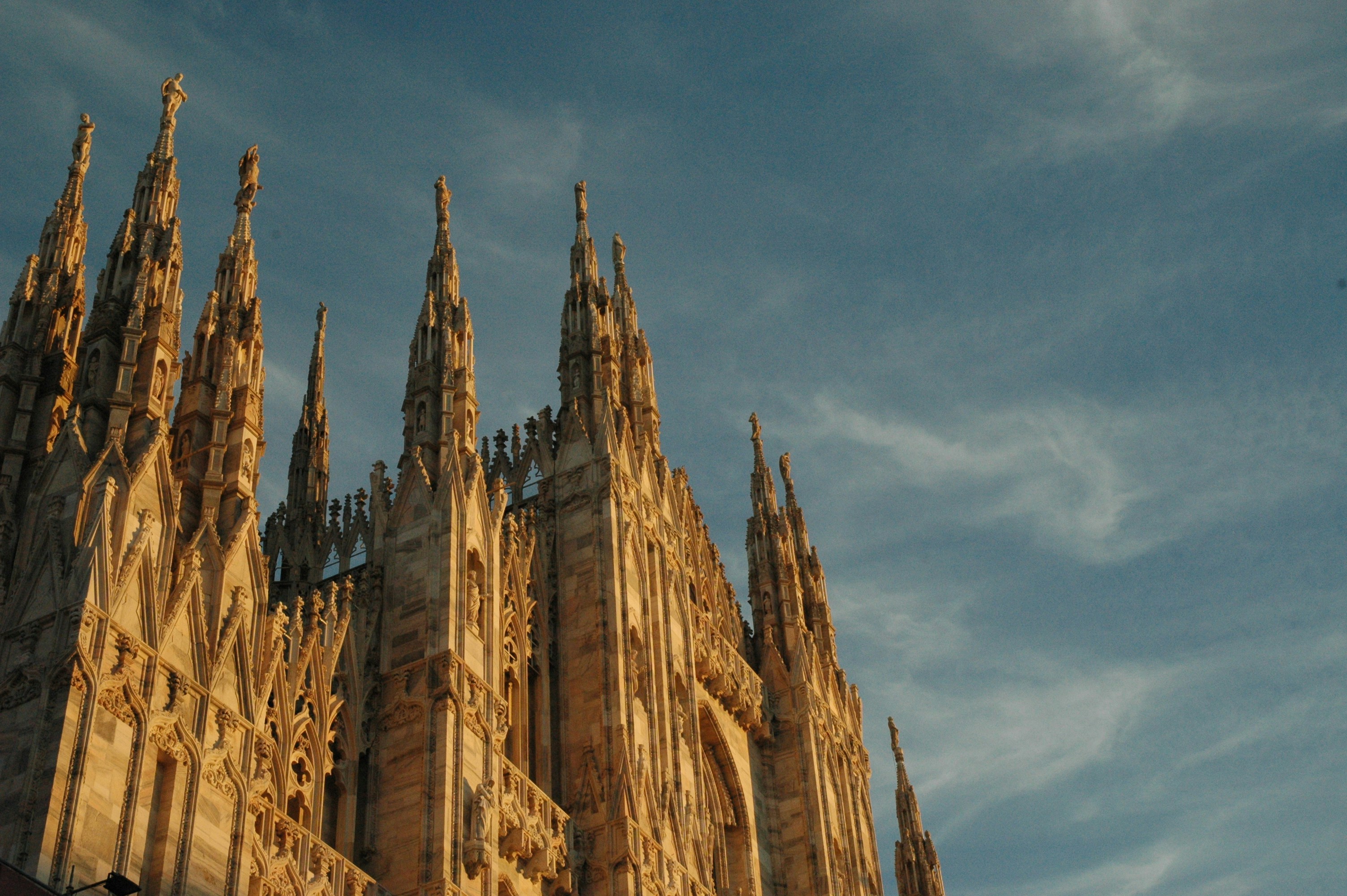 Gothic Peak: Sunlit Spires Against a Clear Sky