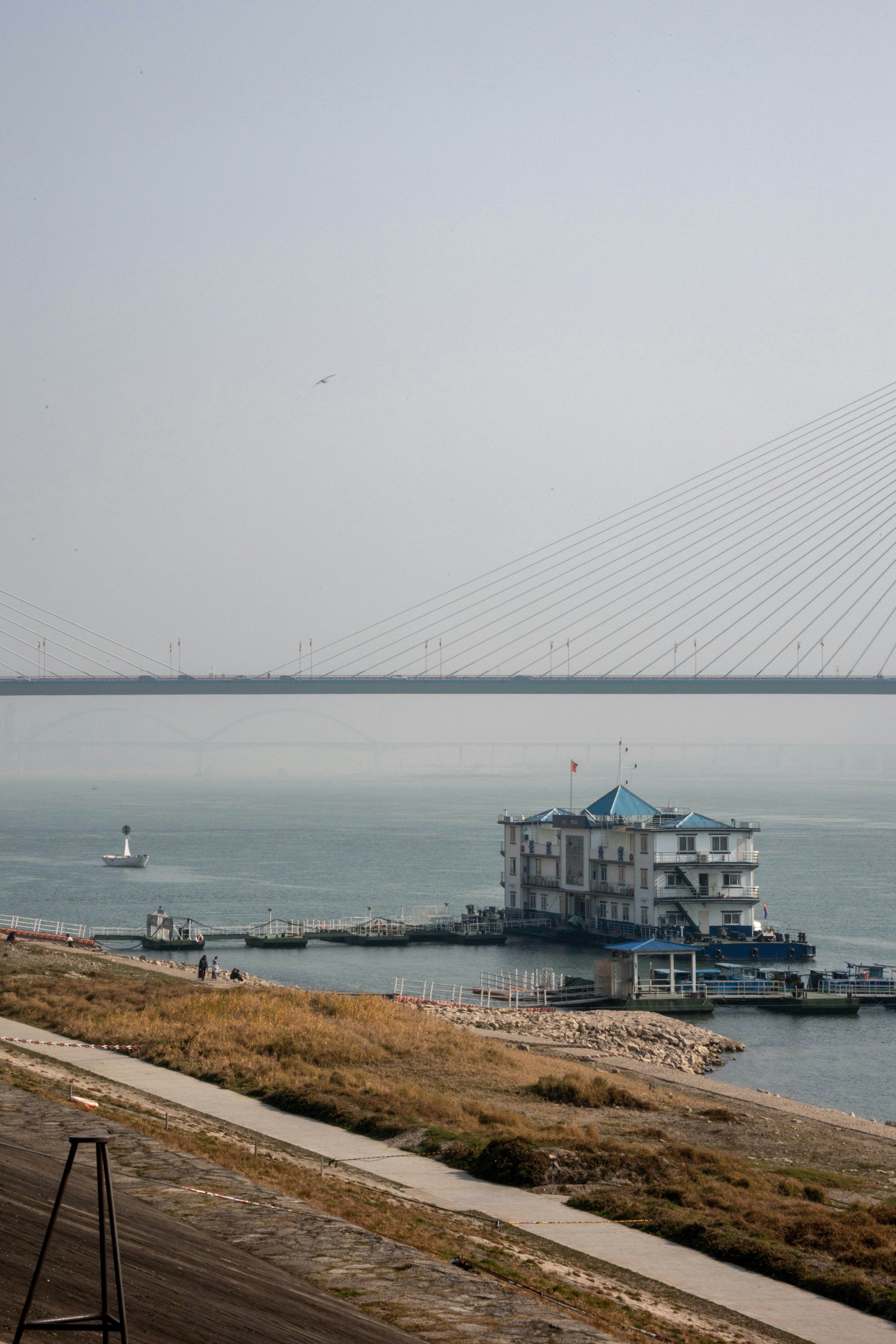 Bridge Over Calm Waters: A Quiet Riverfront Morning
