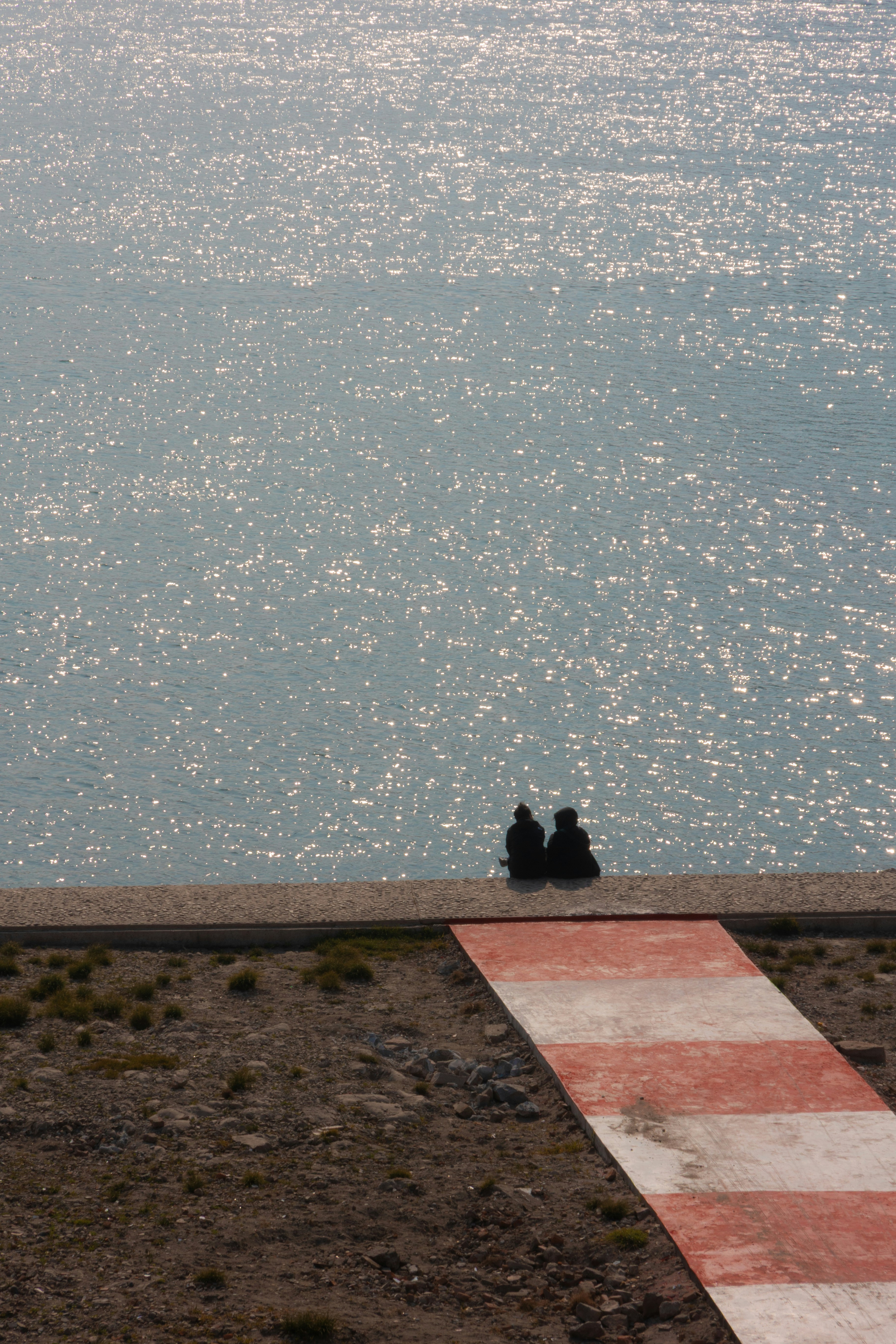 Two Silhouettes on a Distant Emblematic Shore