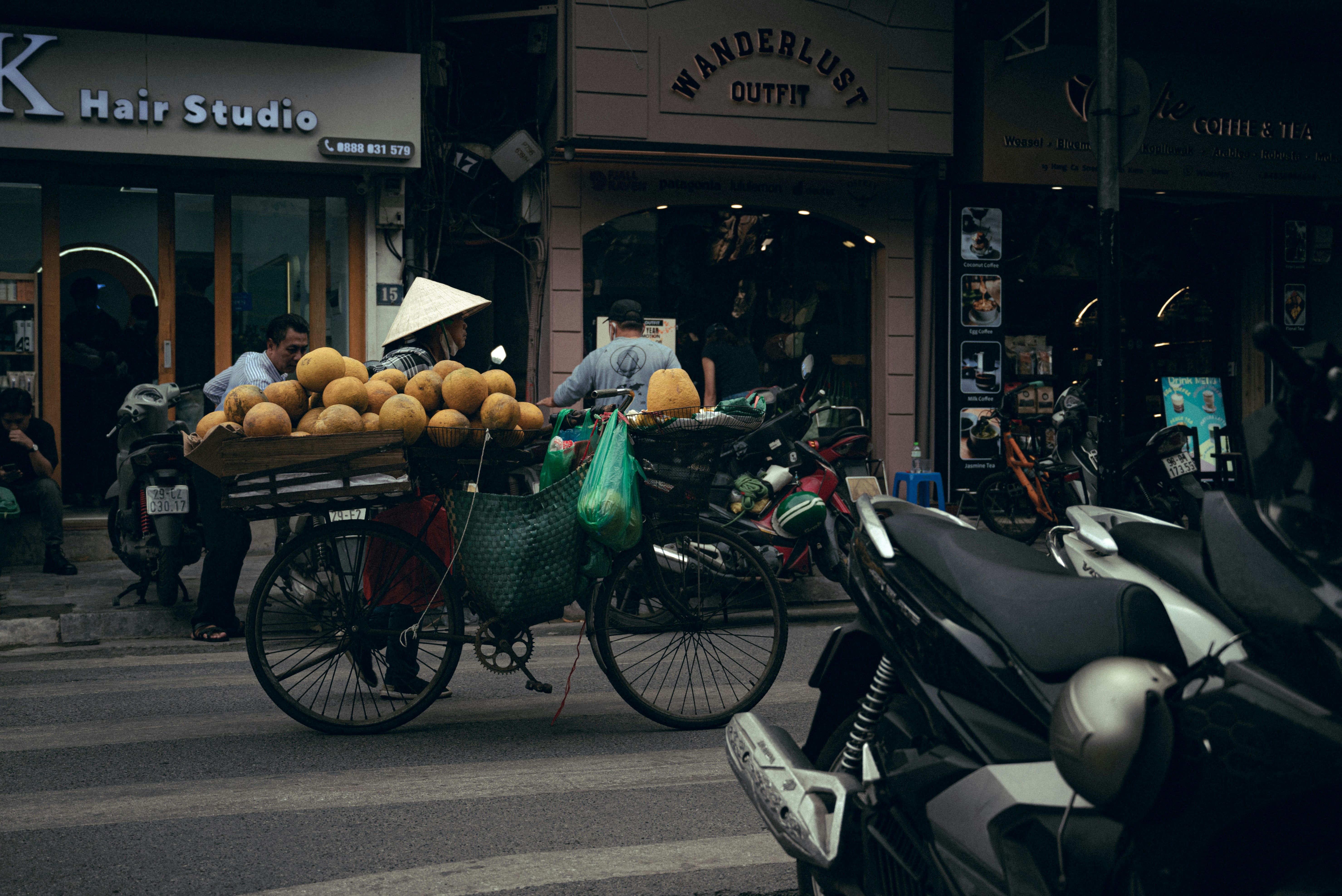 Street Carts and Motorbikes Amid City Facades