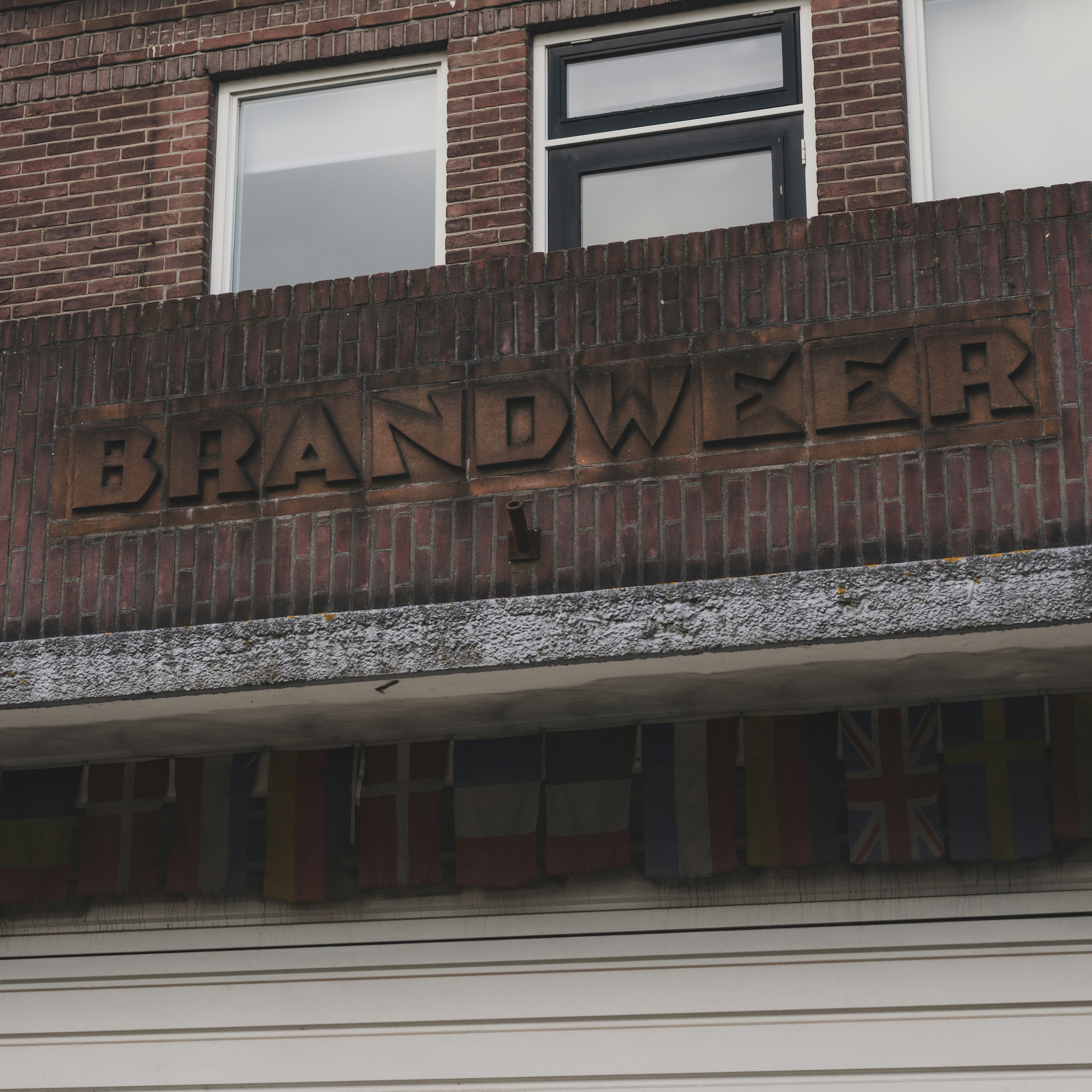 Brick Facade Archive: Brandweer Sign above the Silent Roll-Down