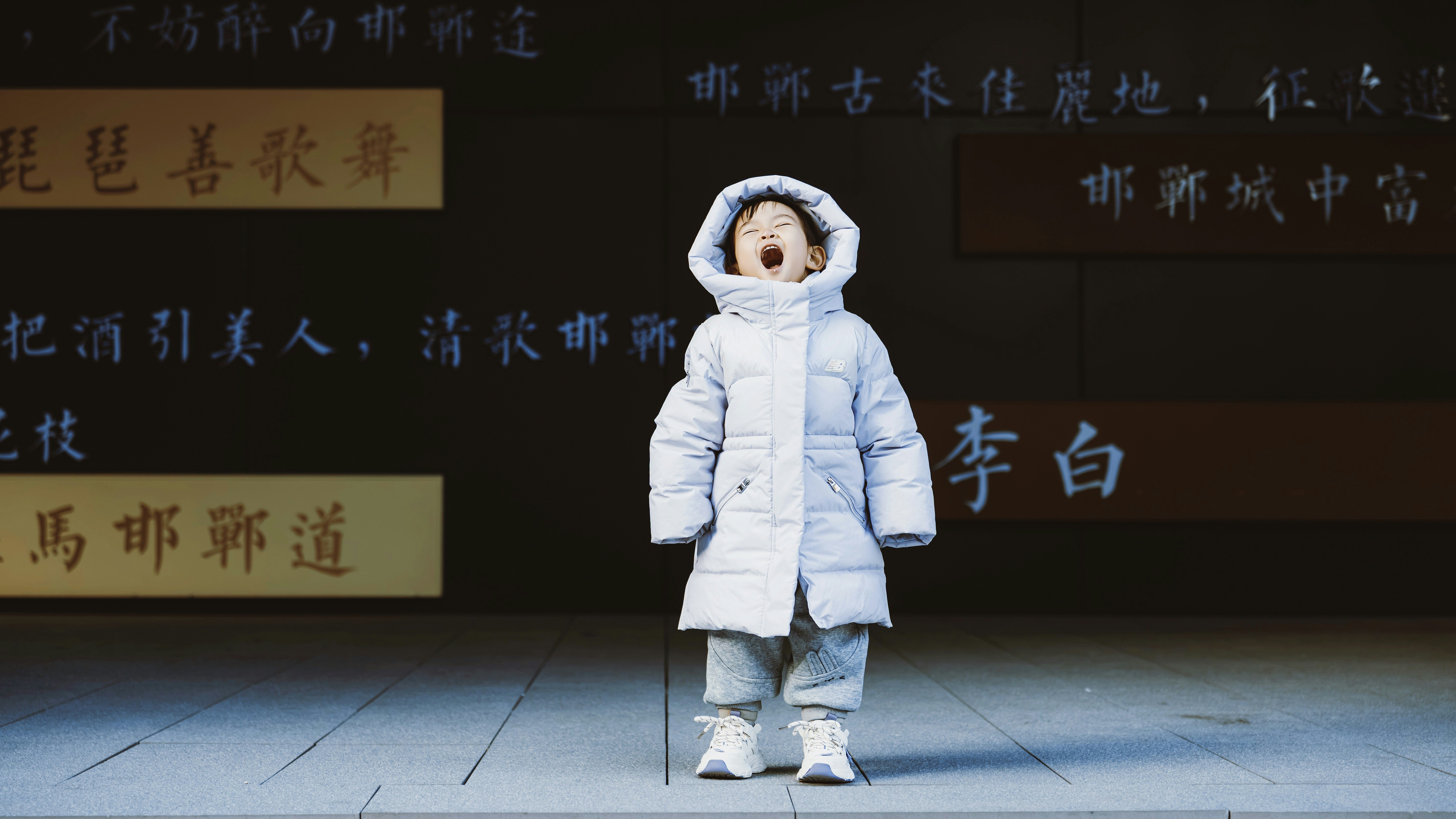 Spotlight in the Silent Stage: Child in a Winter Blue