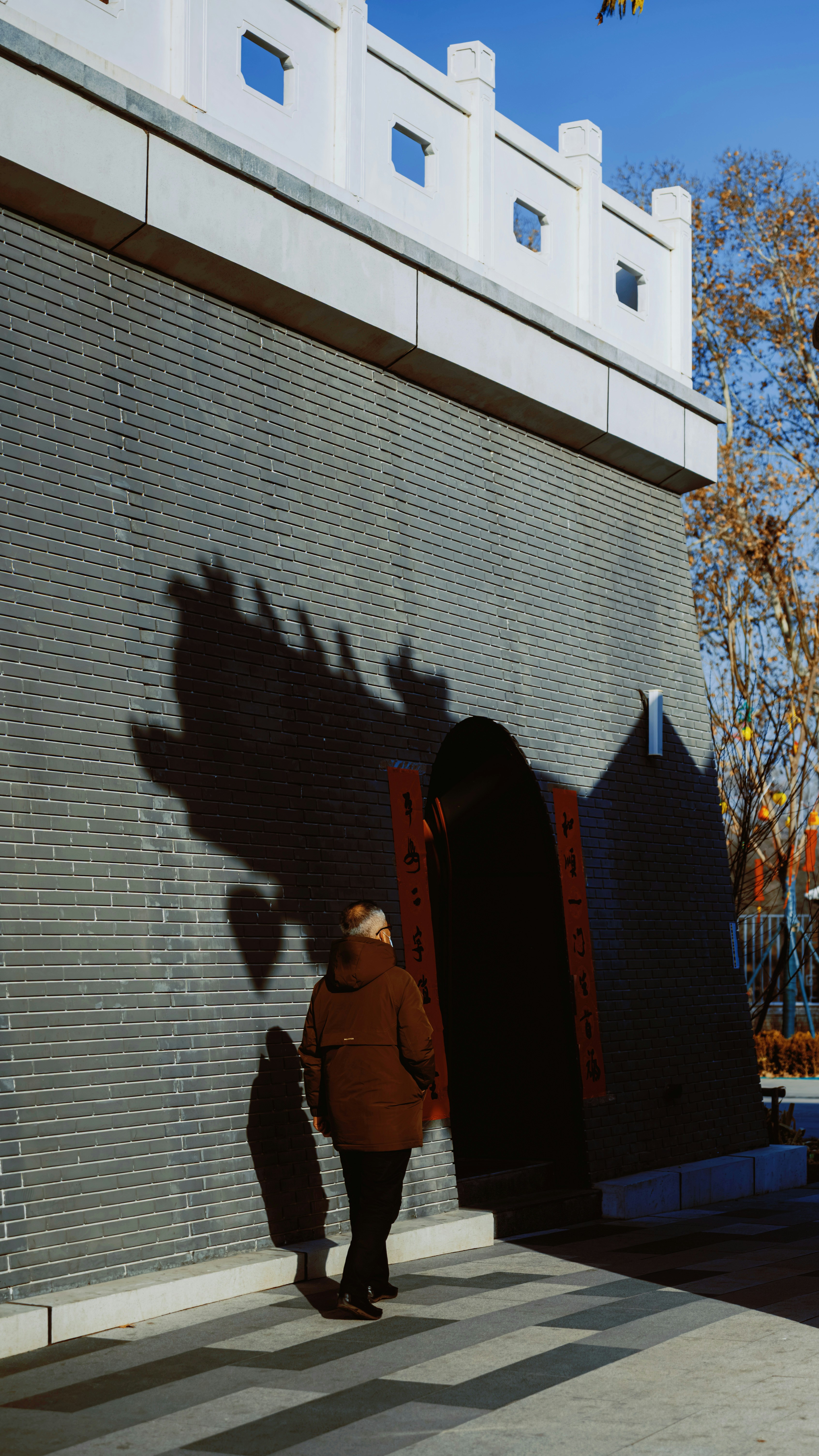 Shadowed Entrance: Quiet Interaction with a Temple Wall