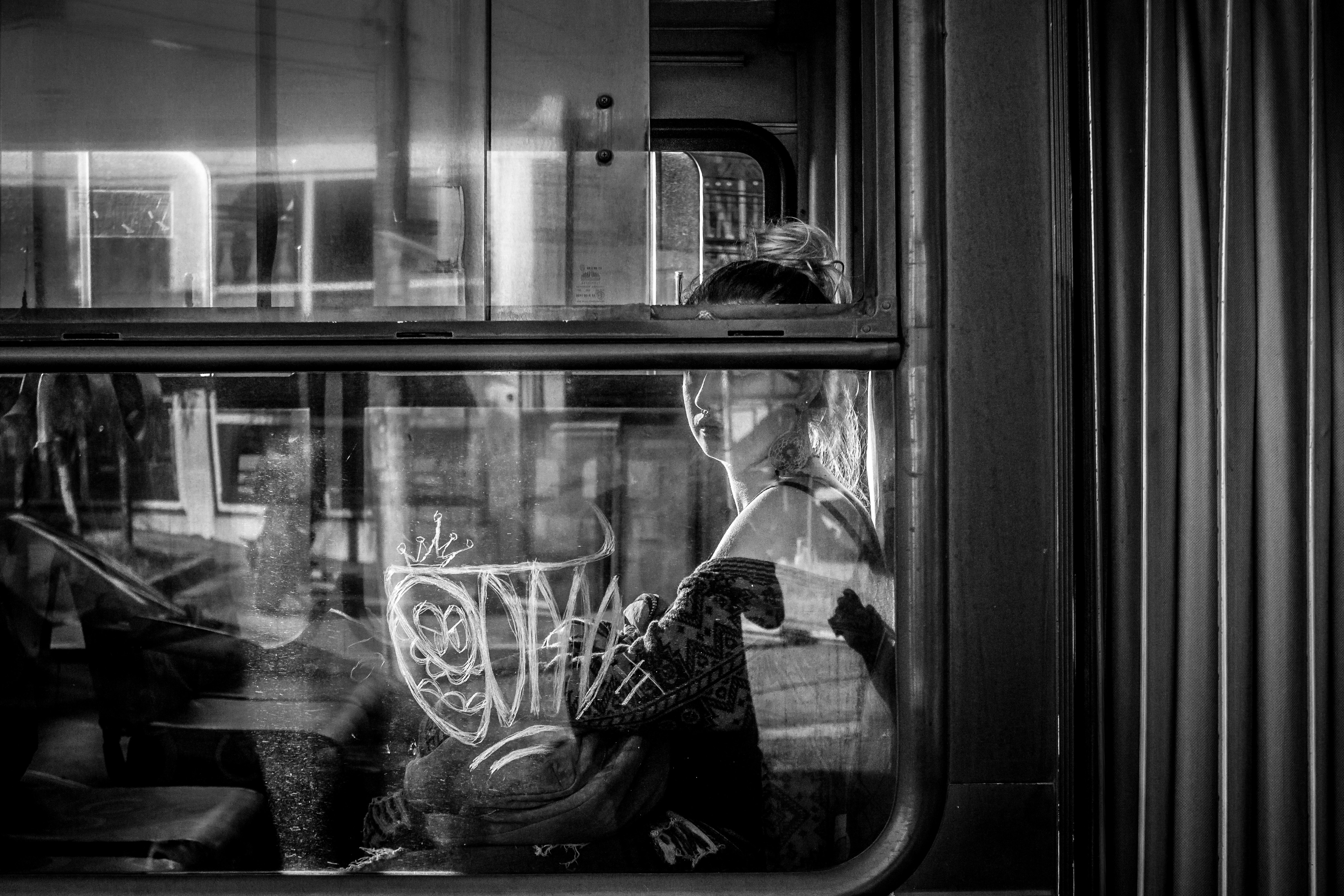 Behind the Glass: A Quiet Gaze Through a City Bus Window