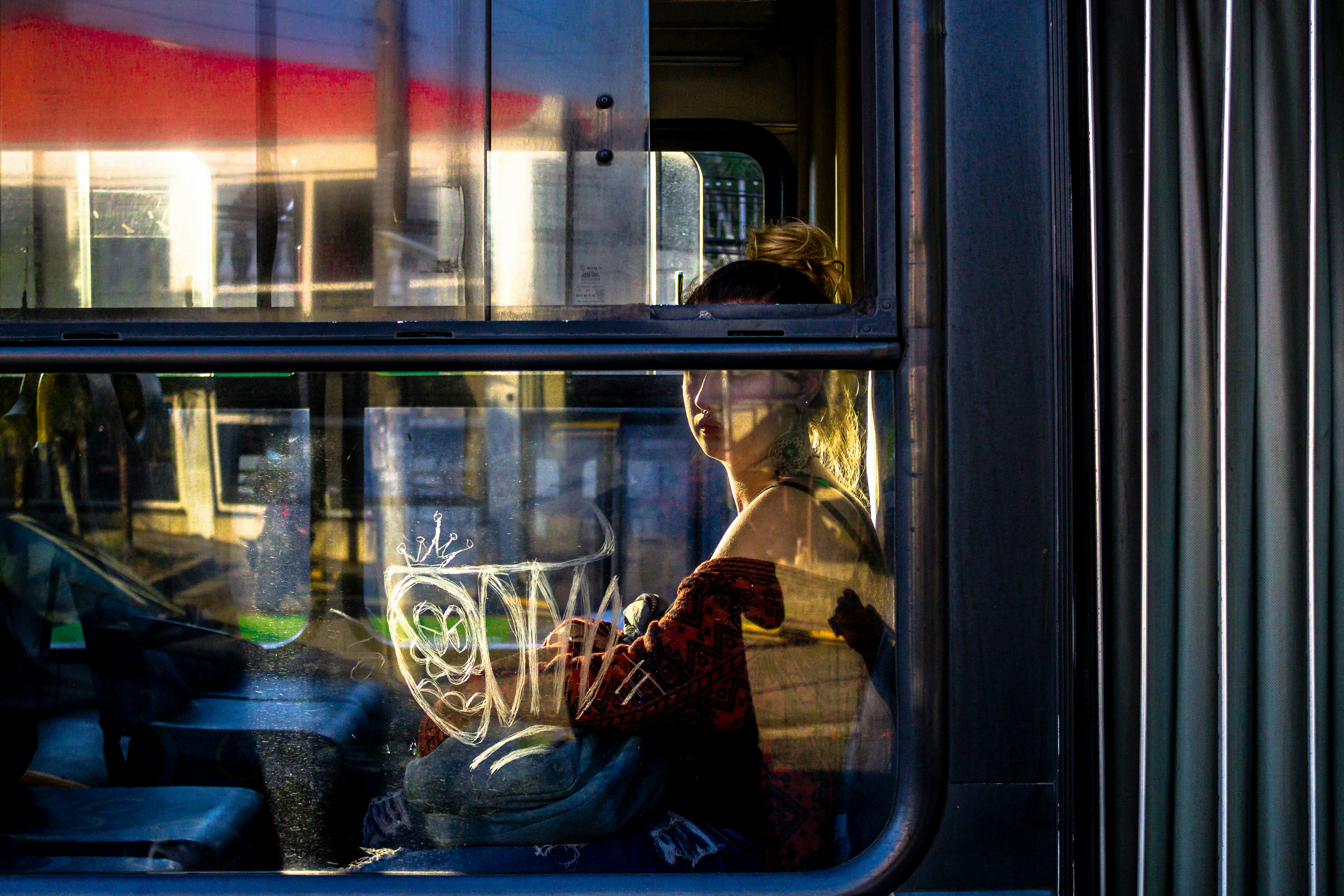 Reflection in the Bus Window: A Quiet Portrait on the Move