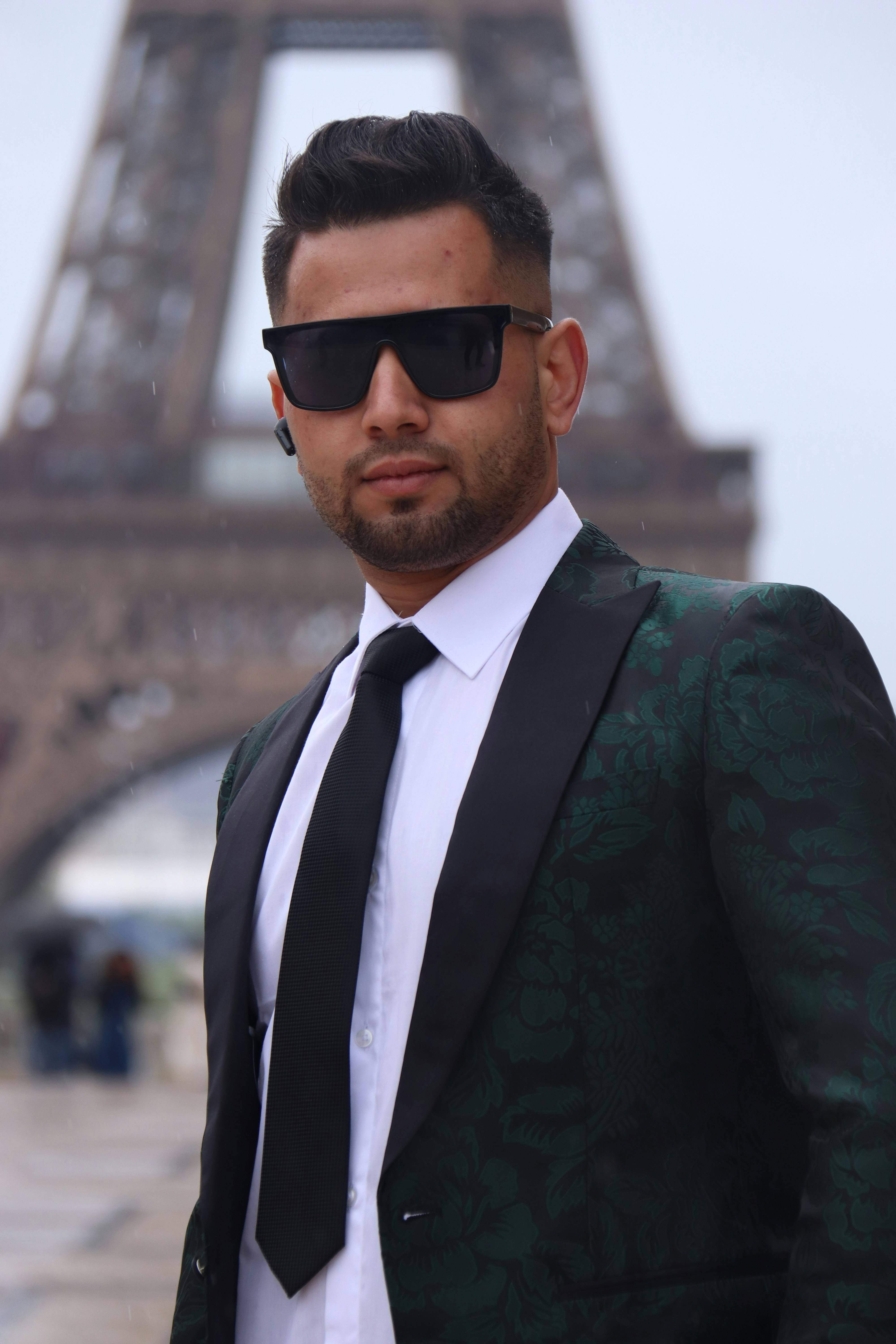 Sleek Confidence in Front of the Eiffel Tower