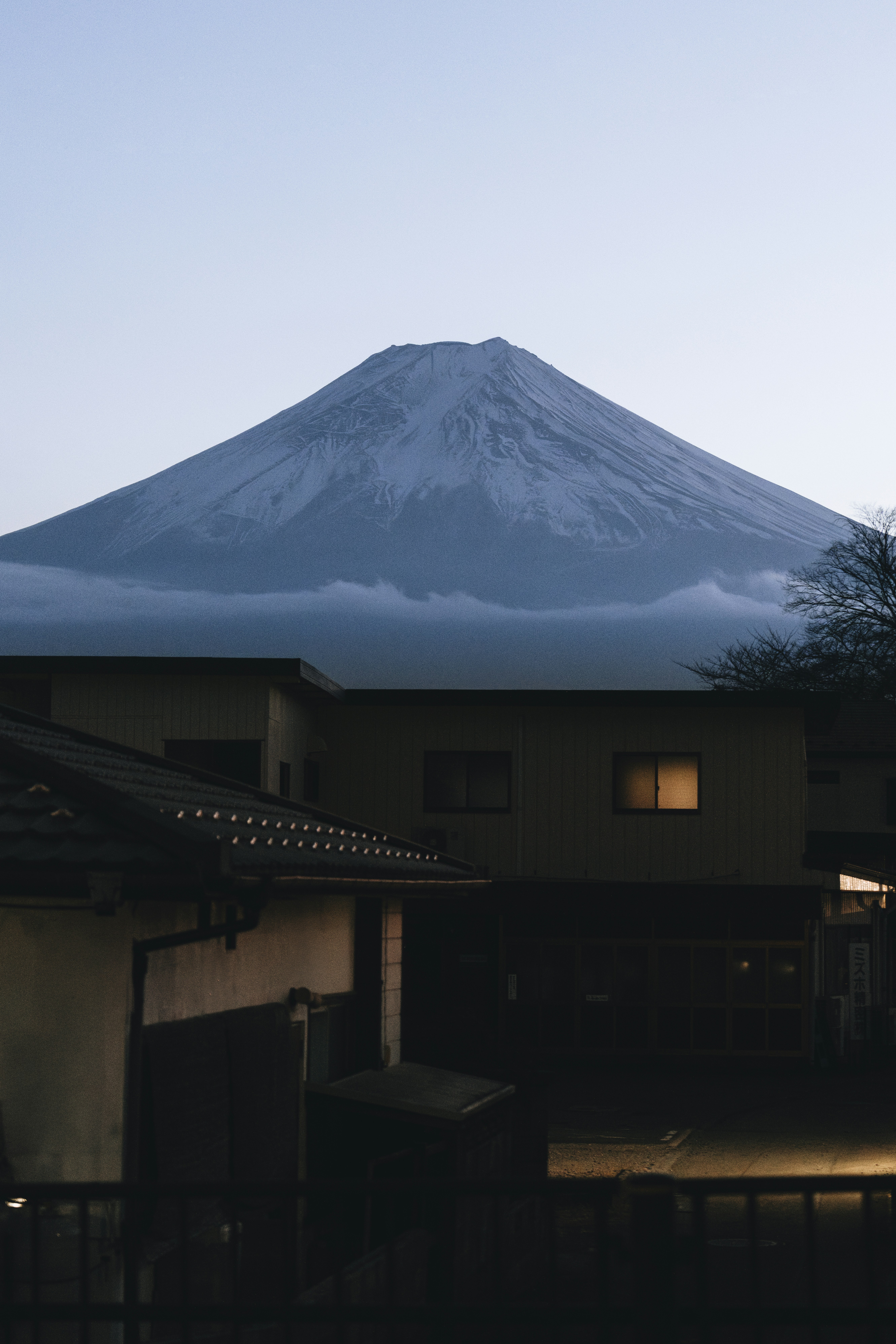 Snow-Capped Peak Over Quiet Town