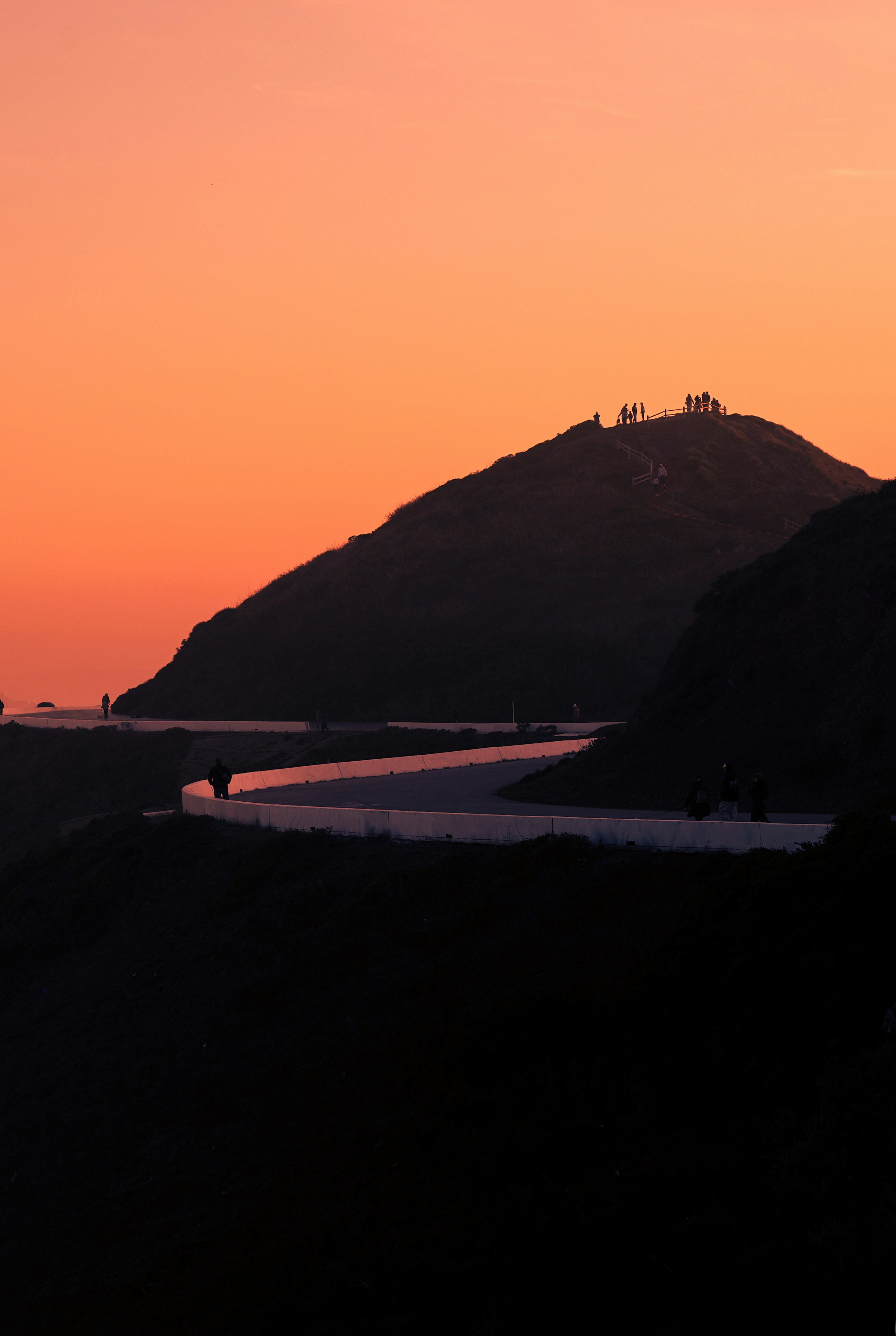 Sunset Spiral: The Silhouette Summit along the Winding Path