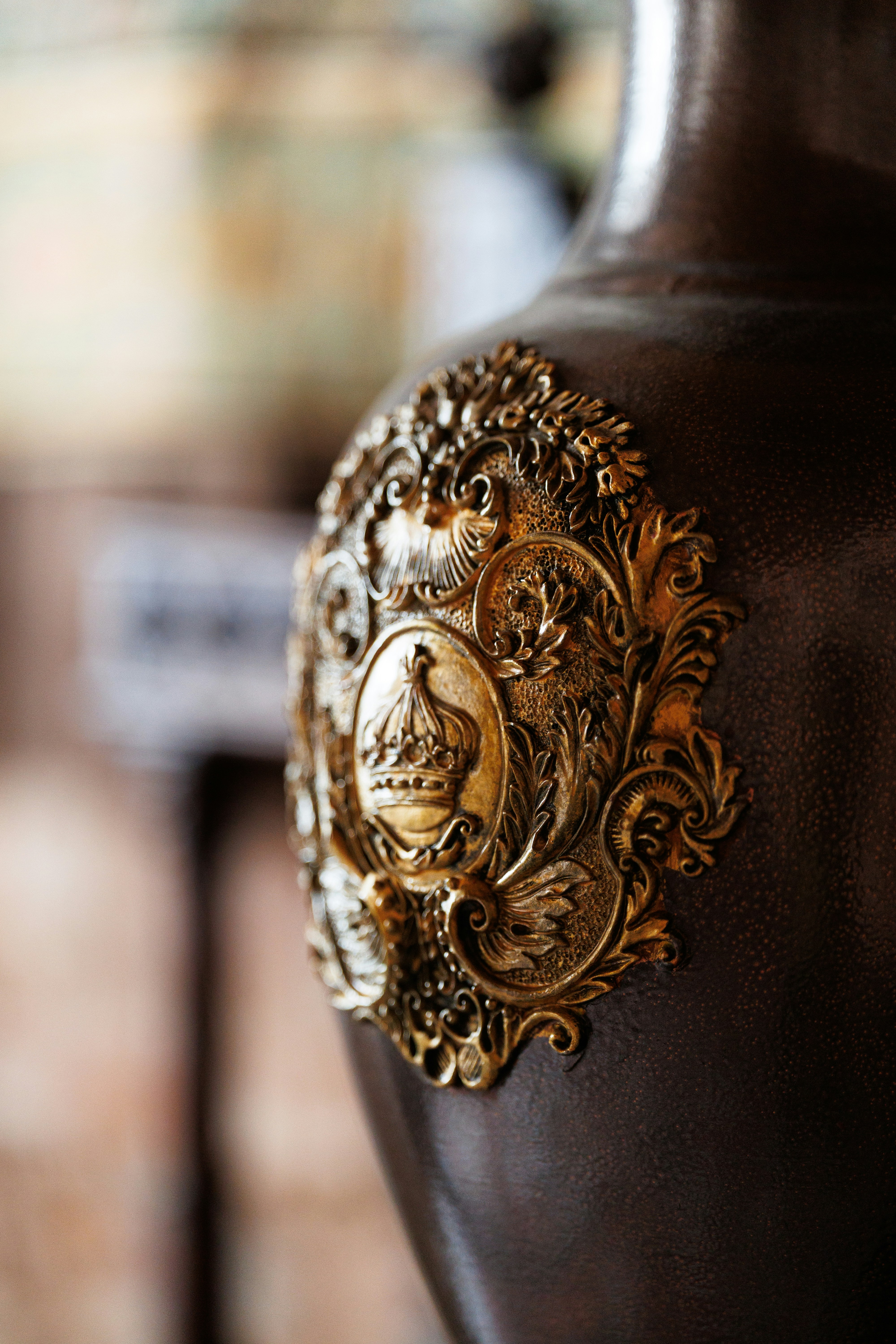 Ornate Crown Emblem on a Vintage Vessel