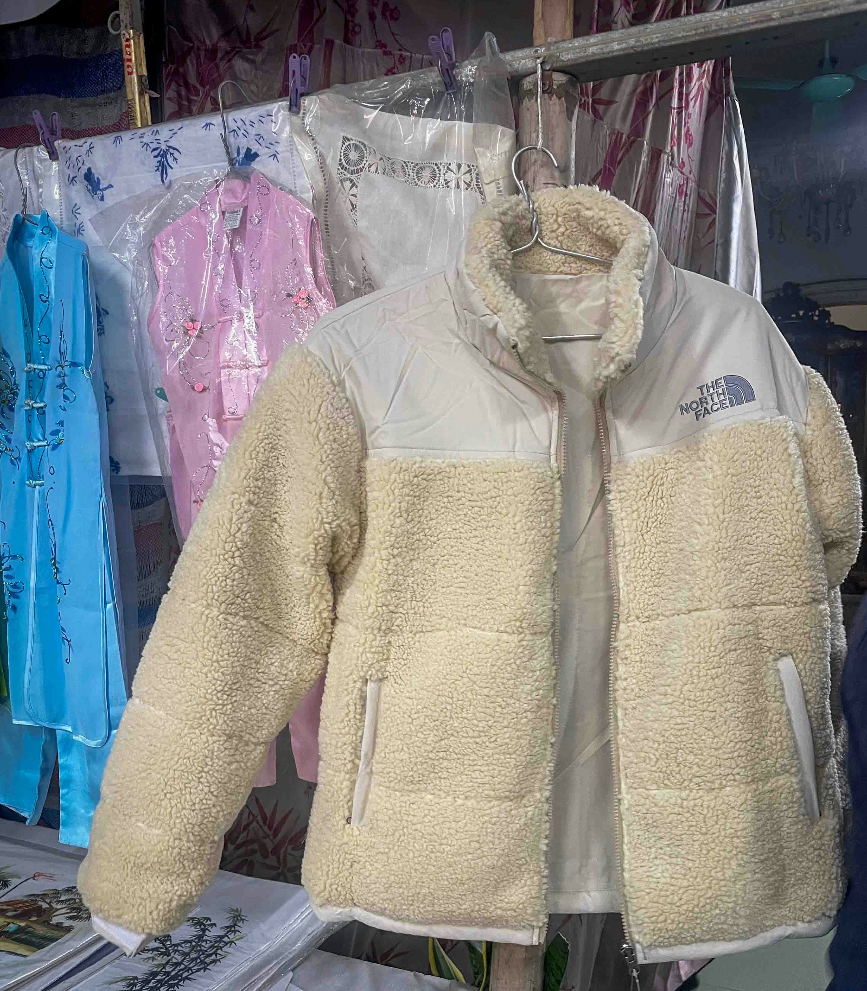 Cream-Blanket Jacket on Display: The North Face puffer with Sherpa Texture