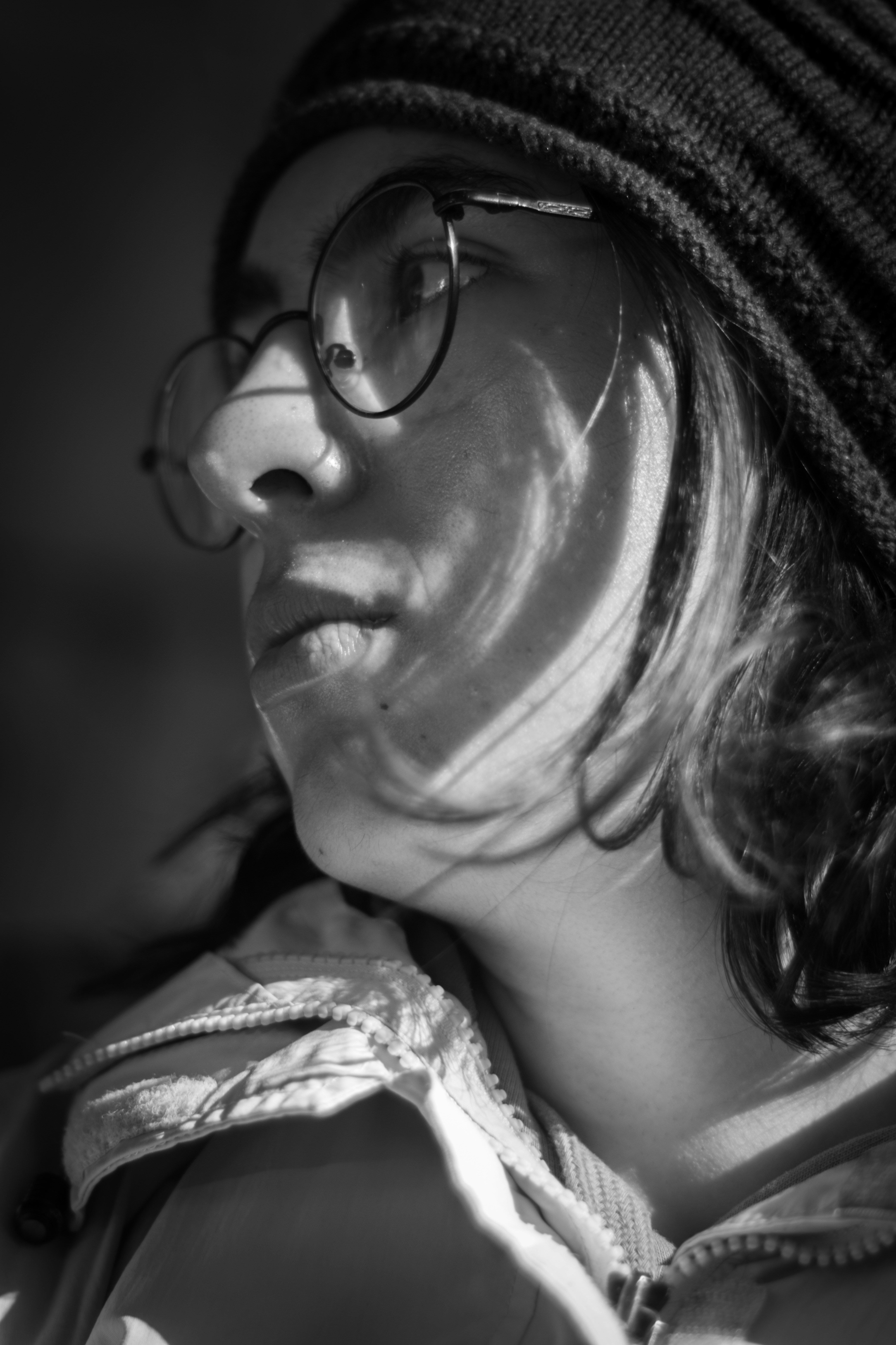 Glasses, Shadow Lines: A Close Bleached Portrait in Mono