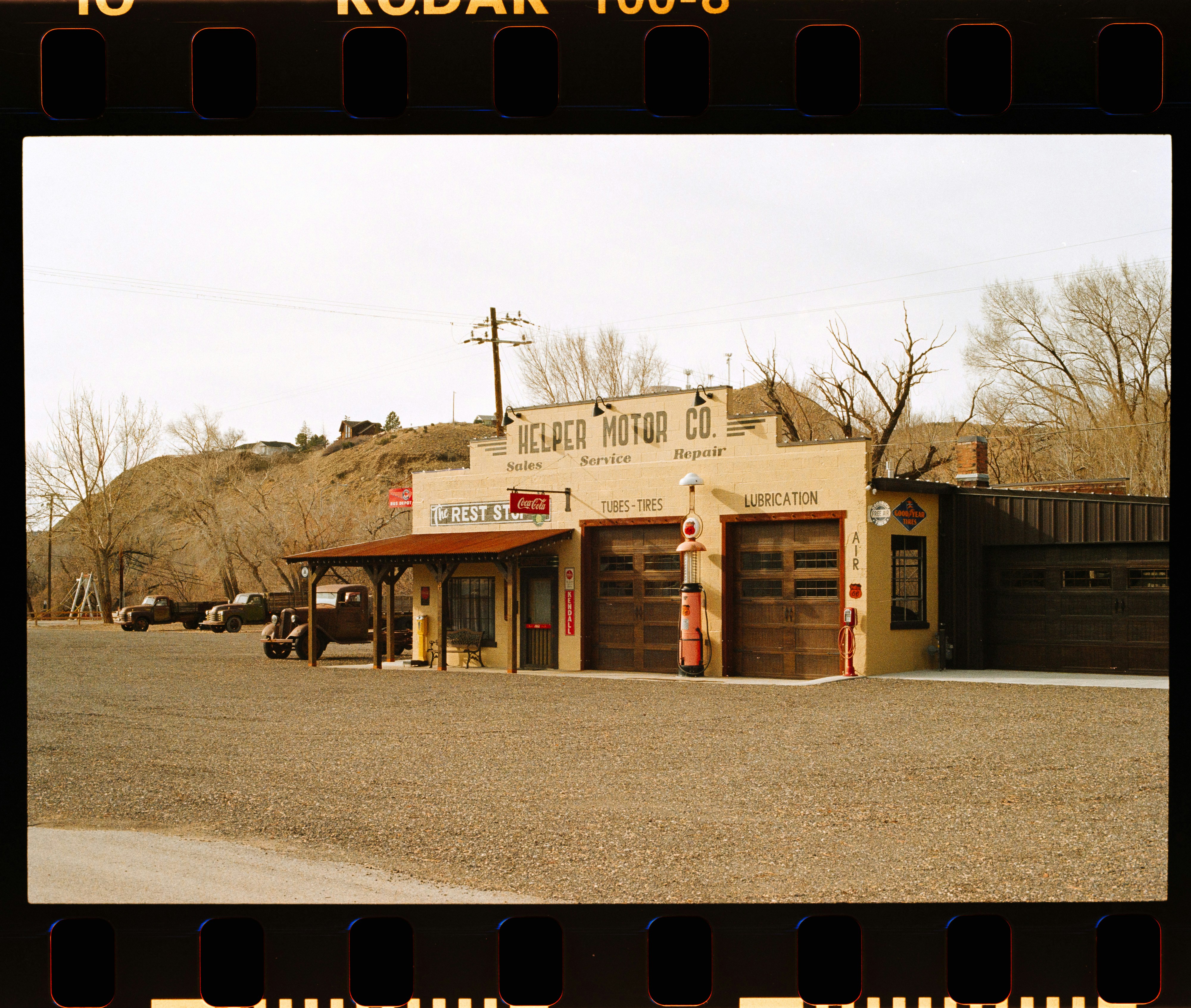 Vintage auto shop along a dusty hillside