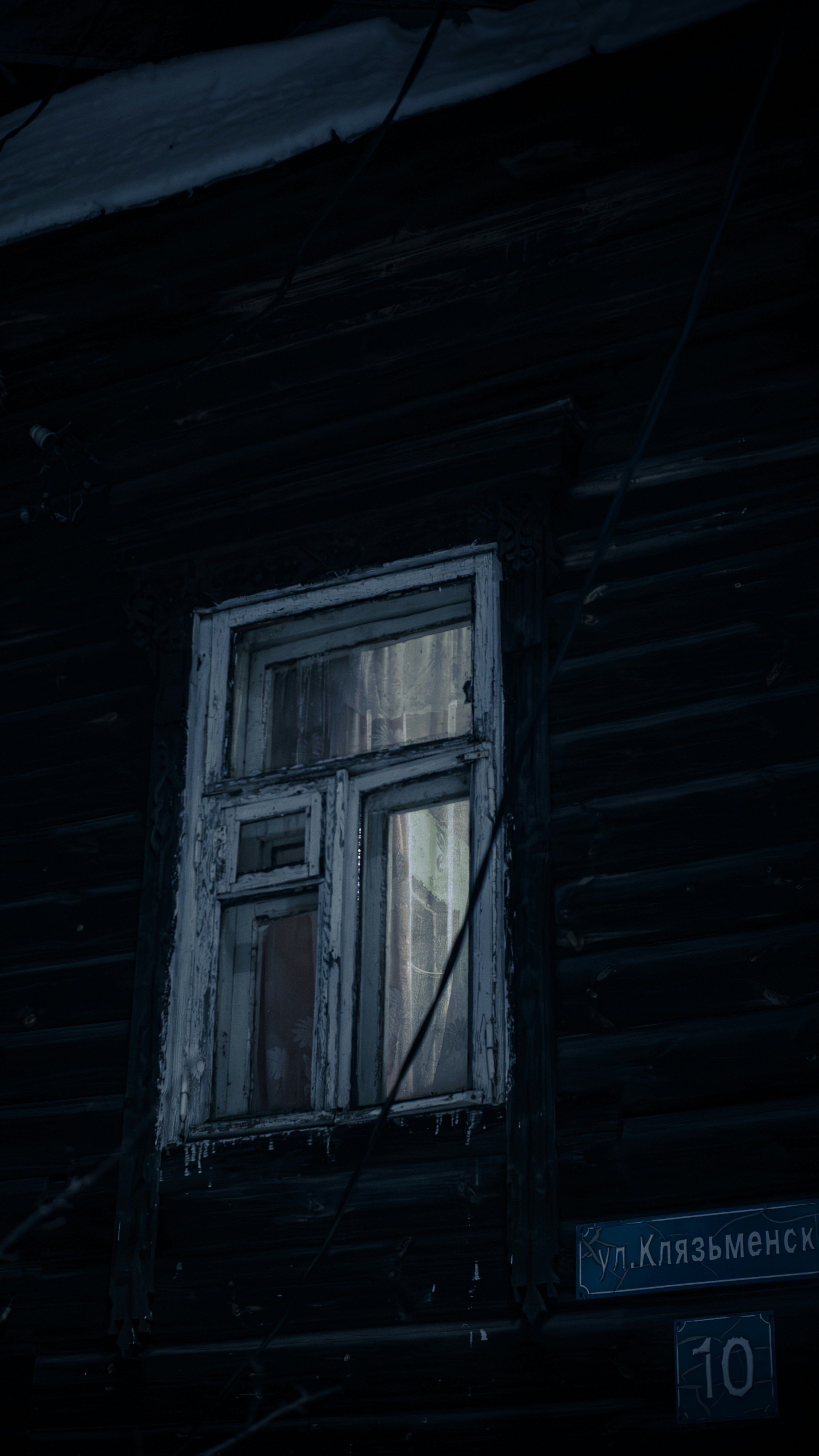 Weathered Window, Silent Snow: A Distant Light in the Dark Wood