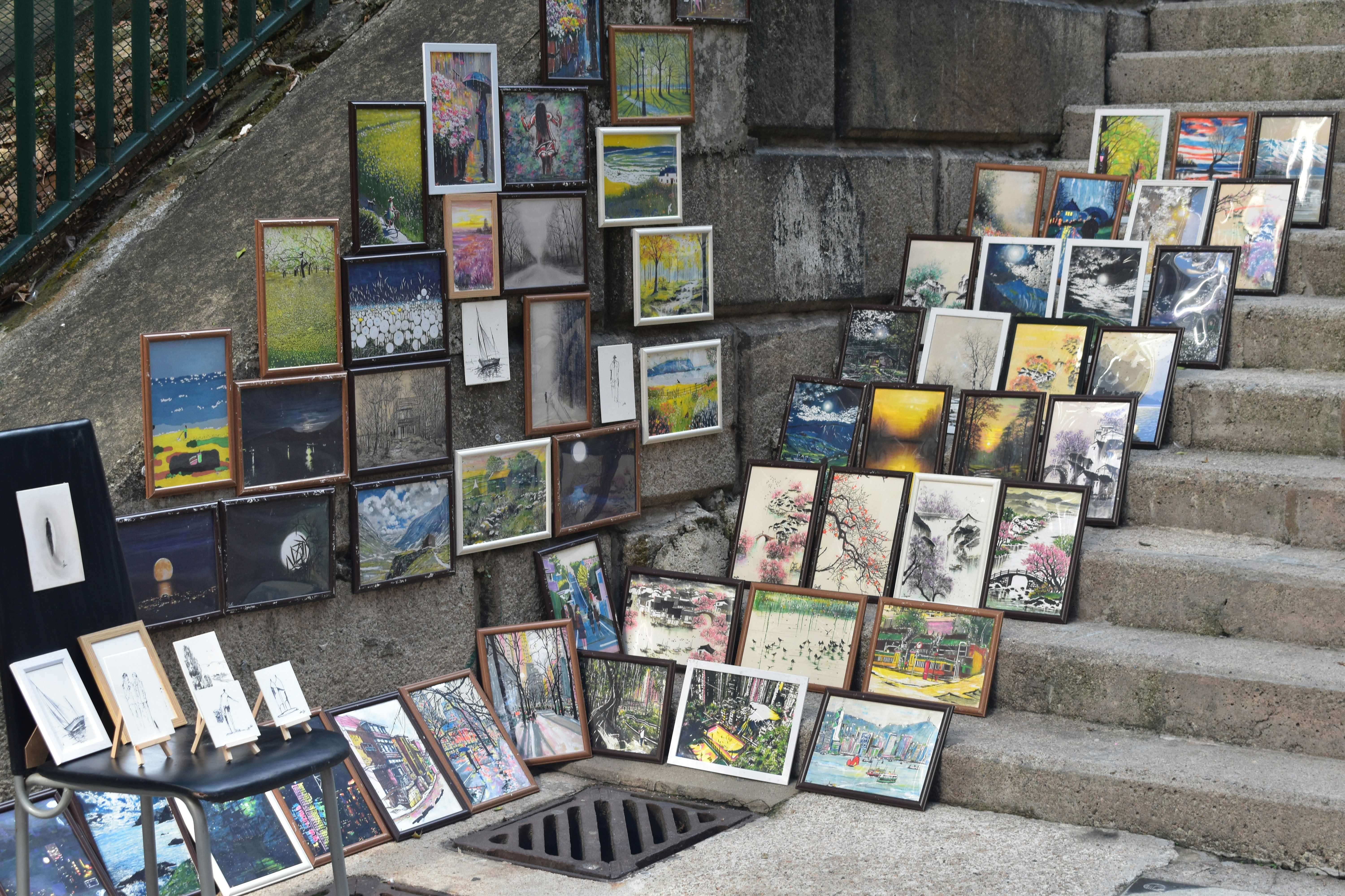 Gallery of Frames: Colorful Portraits Framed Against Concrete Steps