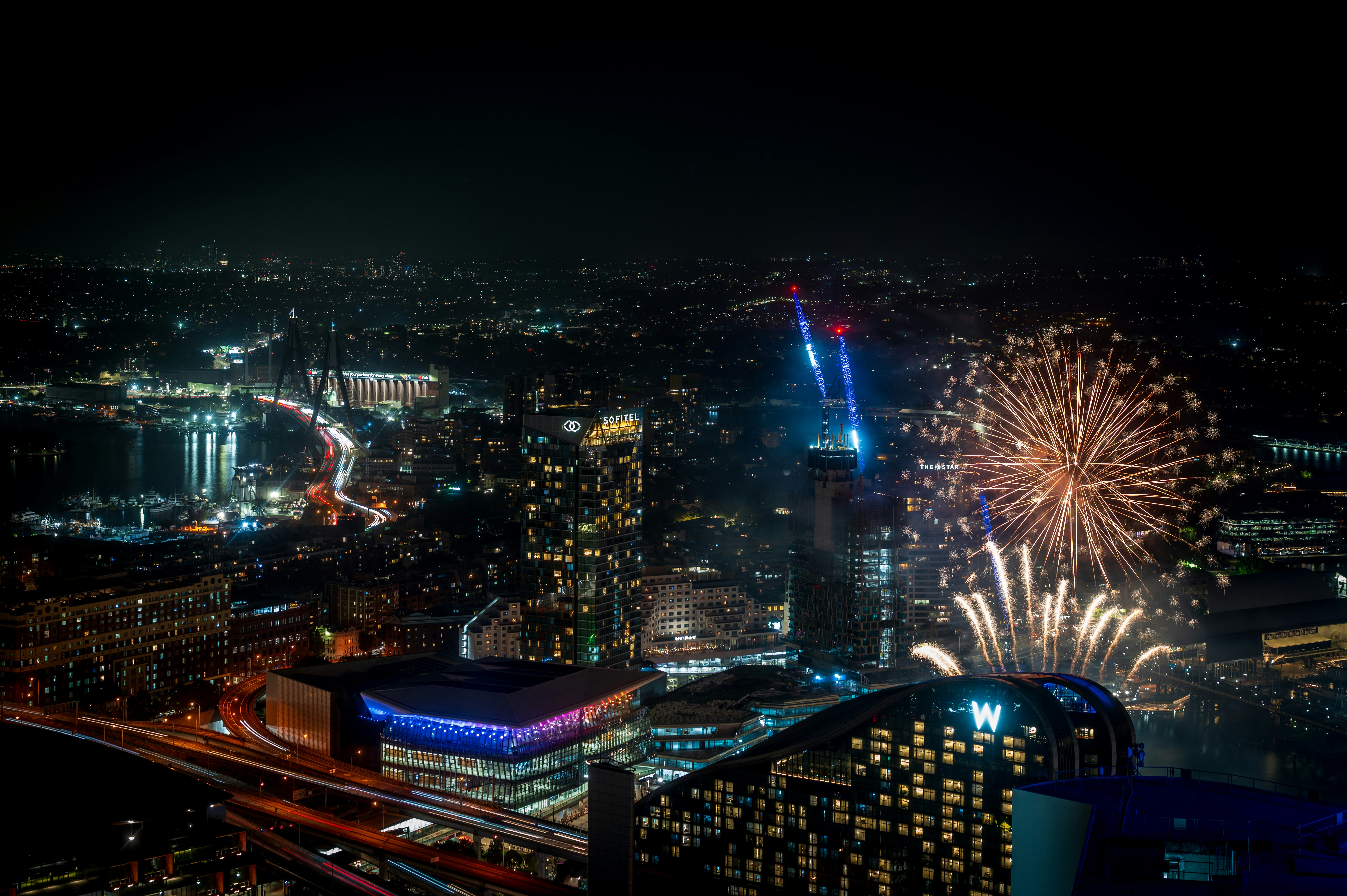 Night Skyburst Over the City: A Carousel of Lights