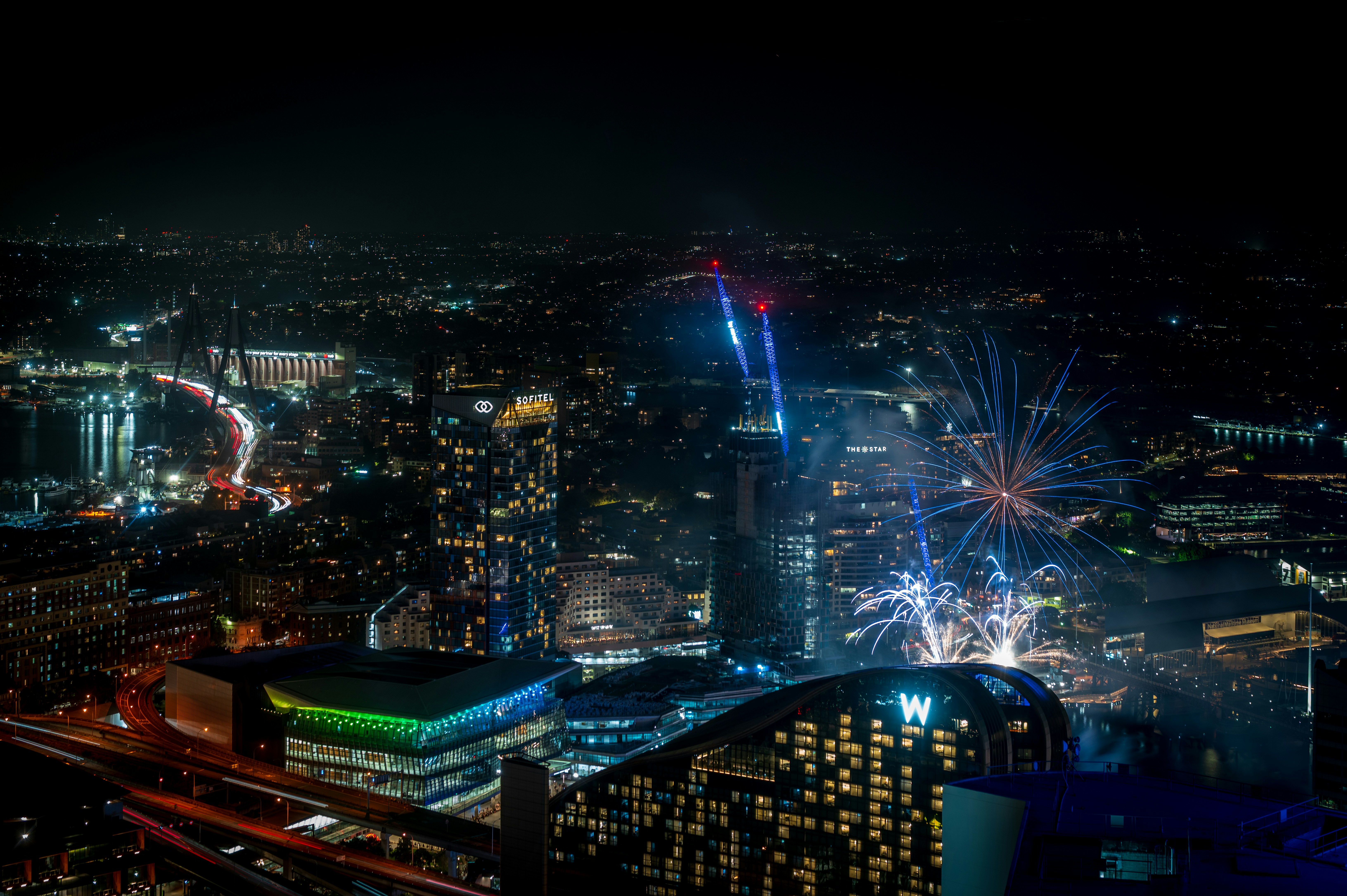 Midnight Skyline: Fireworks Over the Glass Canopy