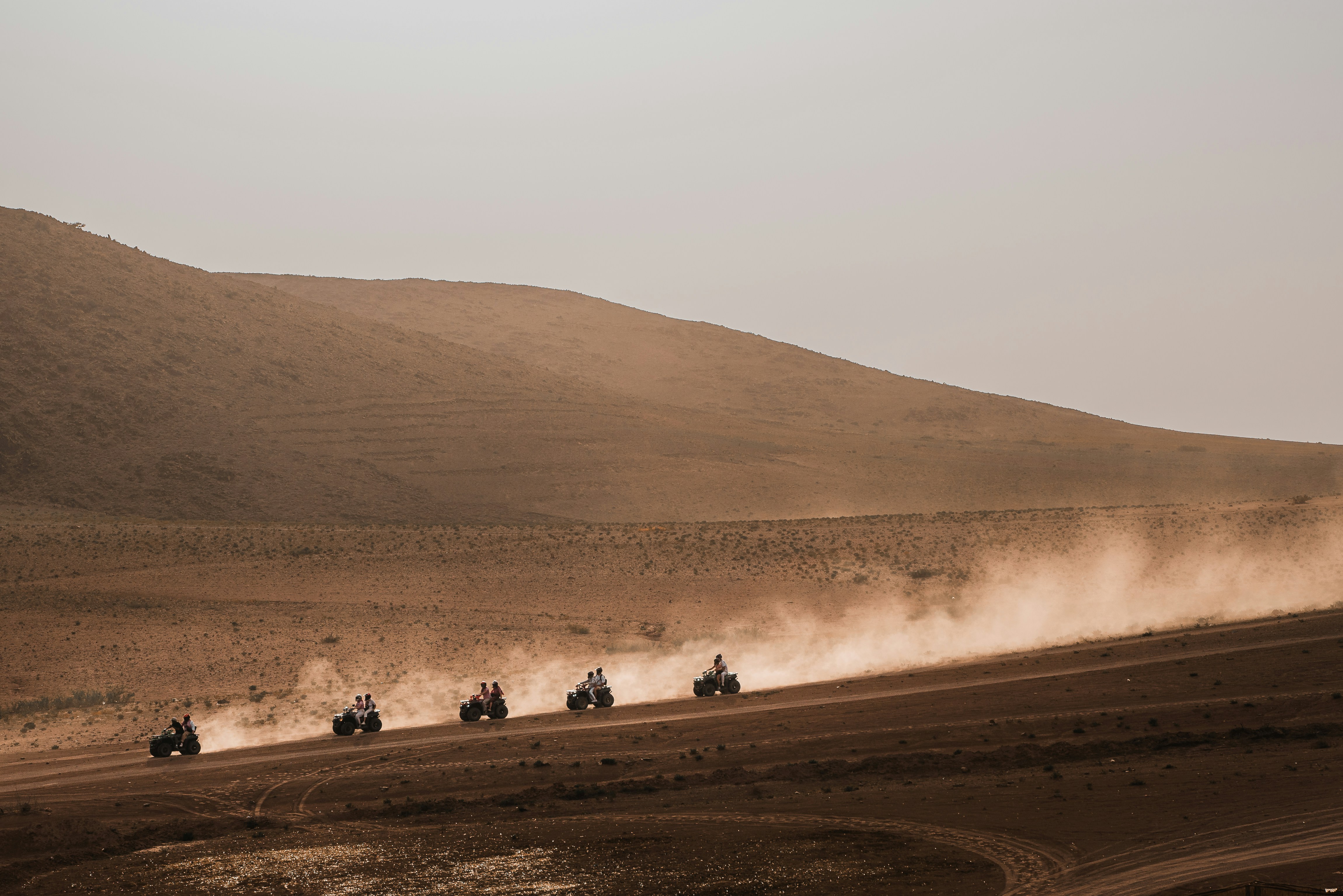 Dust Trails and Dune Ride: Motorbikes Crater the Horizon