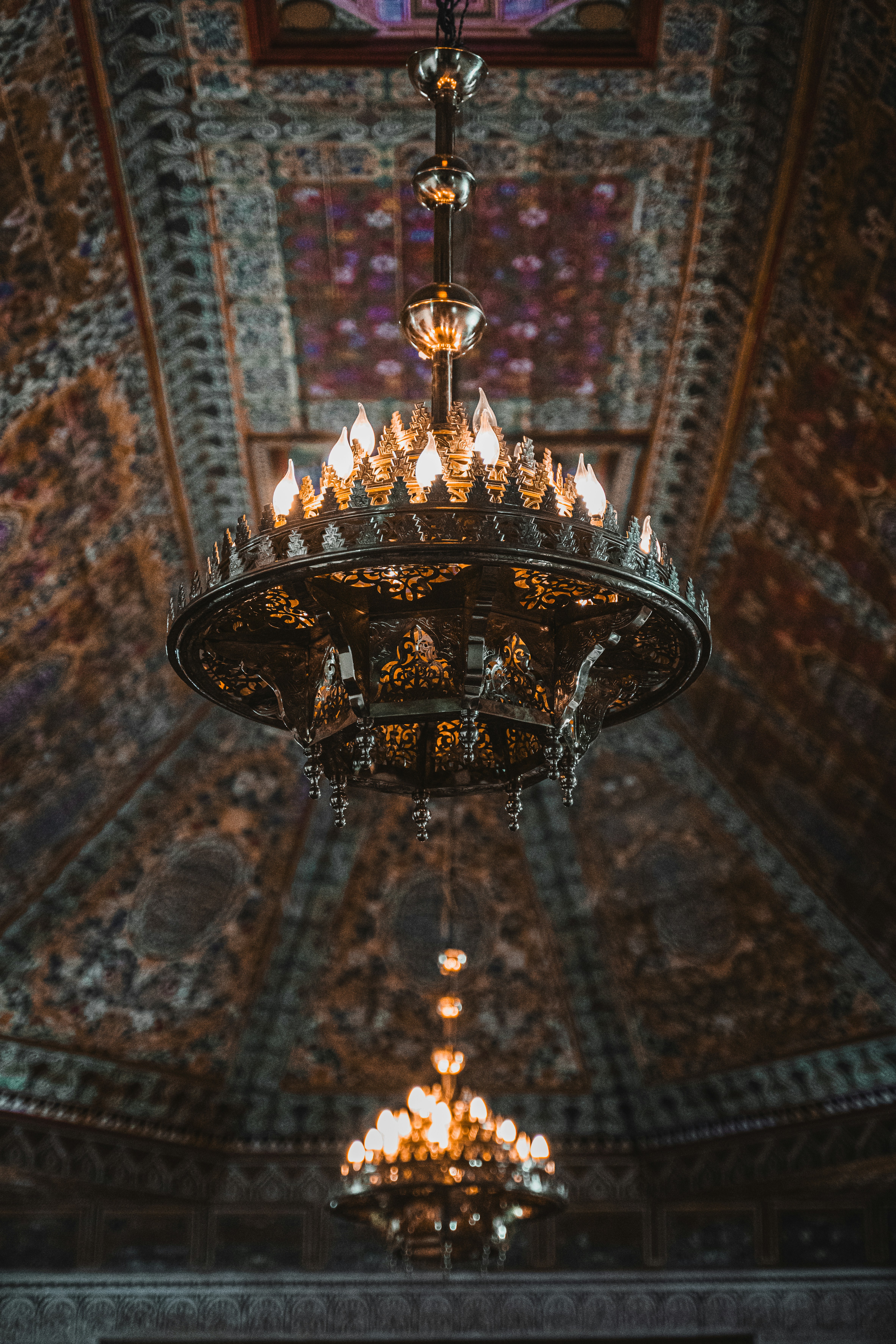 Midair Lanterns: A Grand Ottoman Chandelier in Dimly Lit Splendor