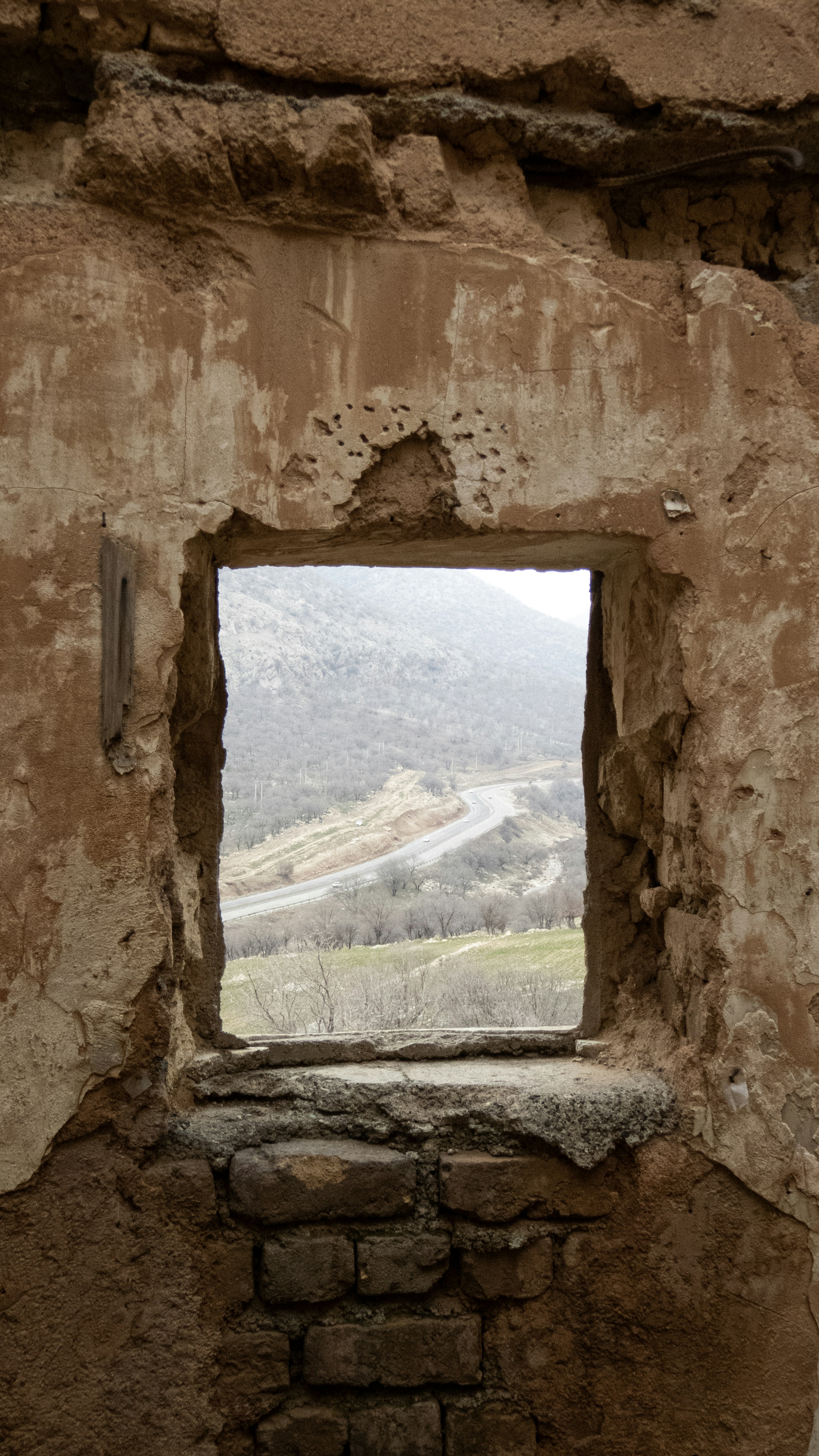 Through the Window of Time: A Stone Frame to a Winding Road