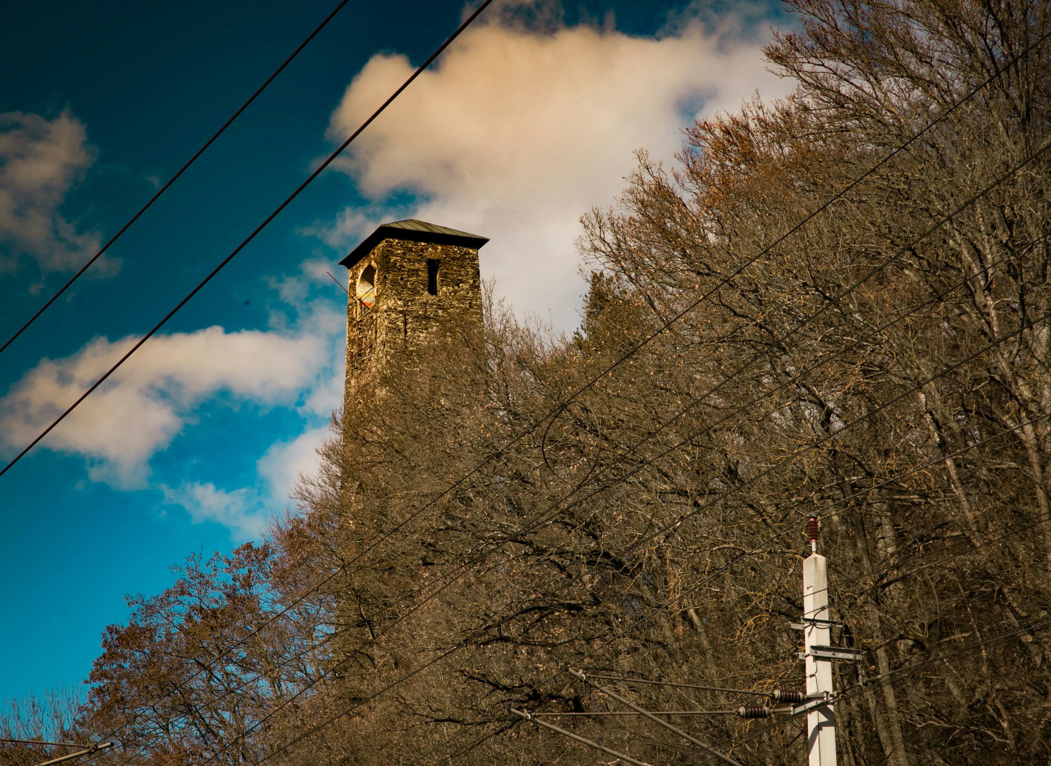 Tower Silhouette Above Winter Ridge