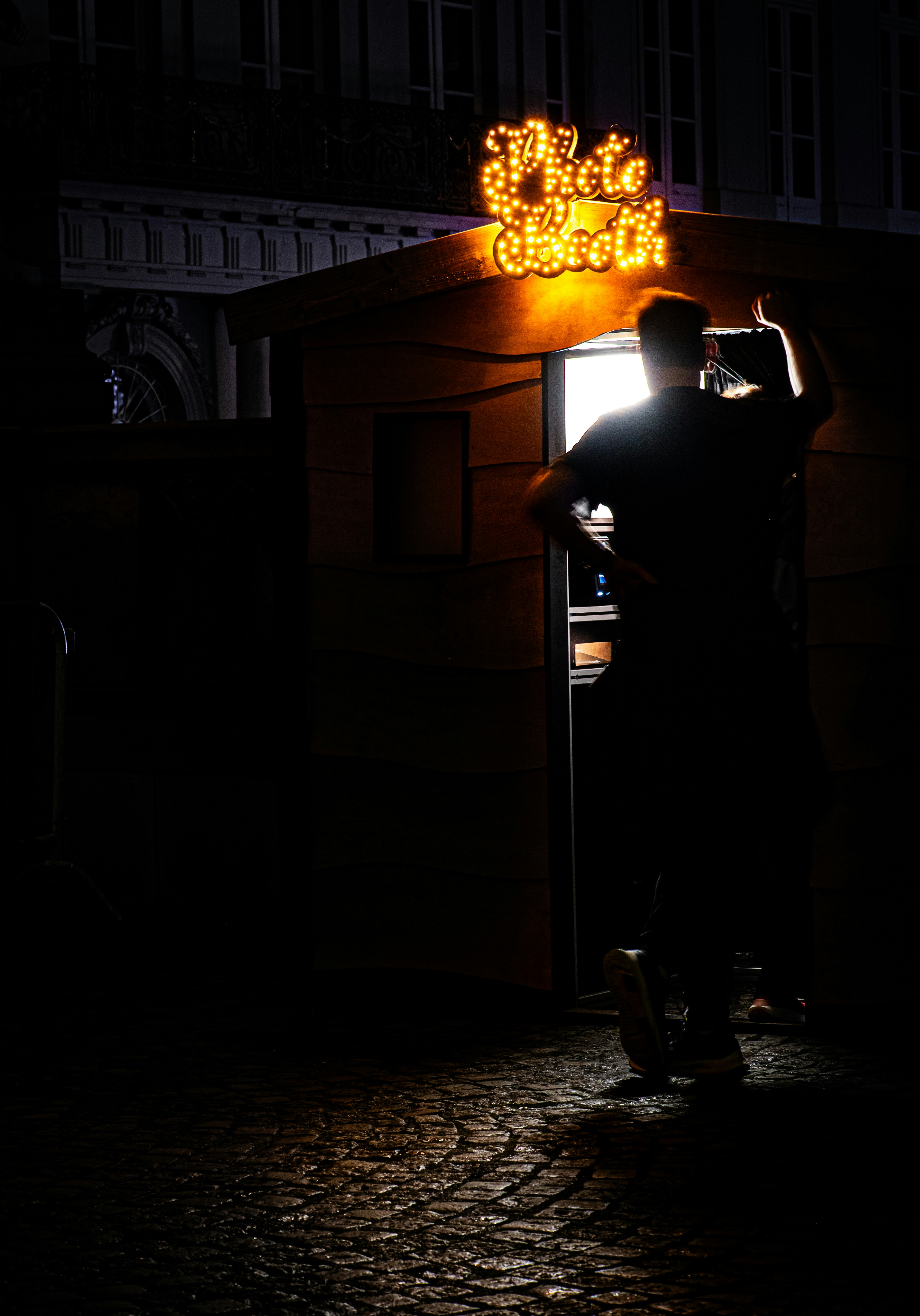 Silhouette at the Neon-Glow Snack Stand