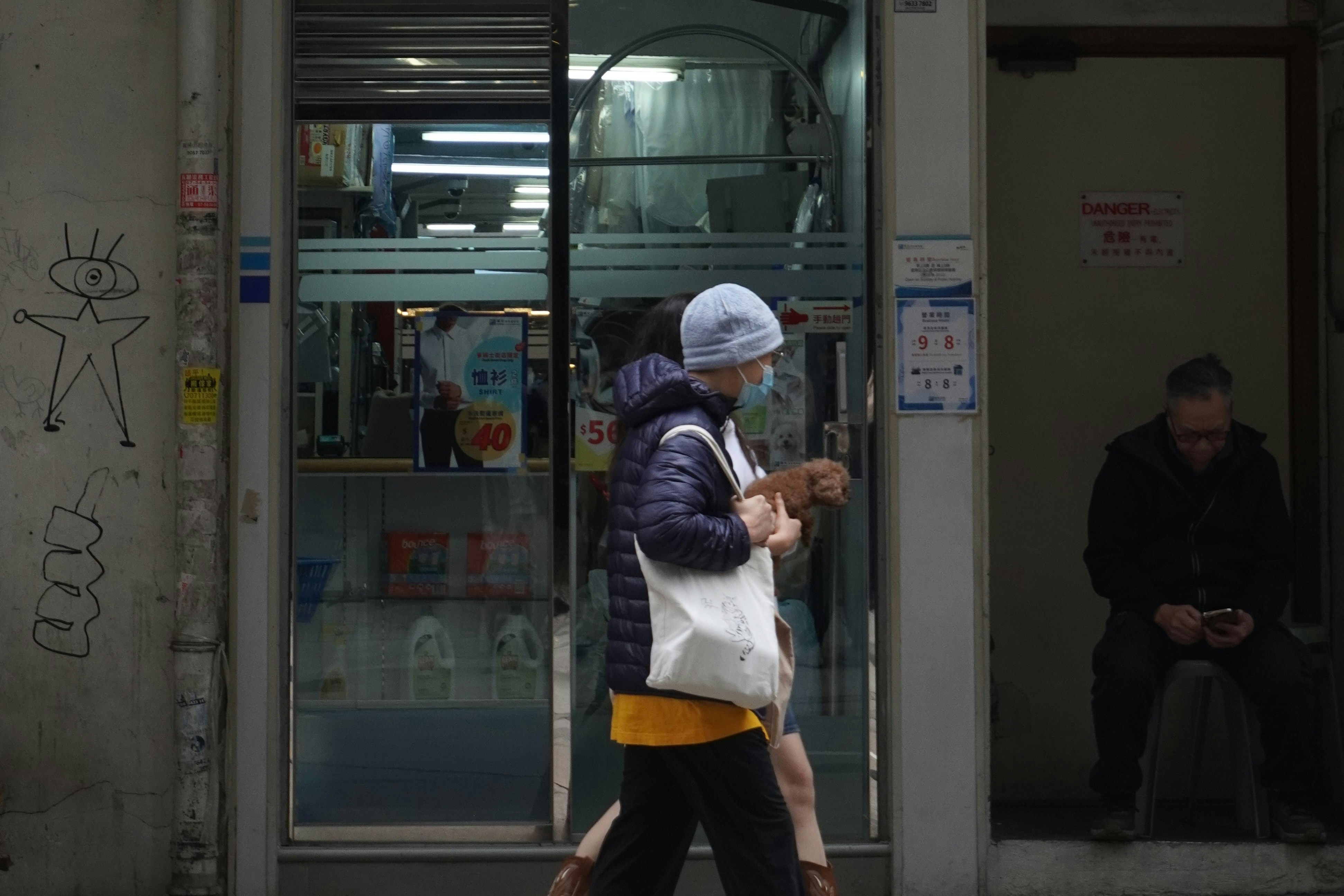 Passerby with Tote: Quiet Moment at a Corner Convenience