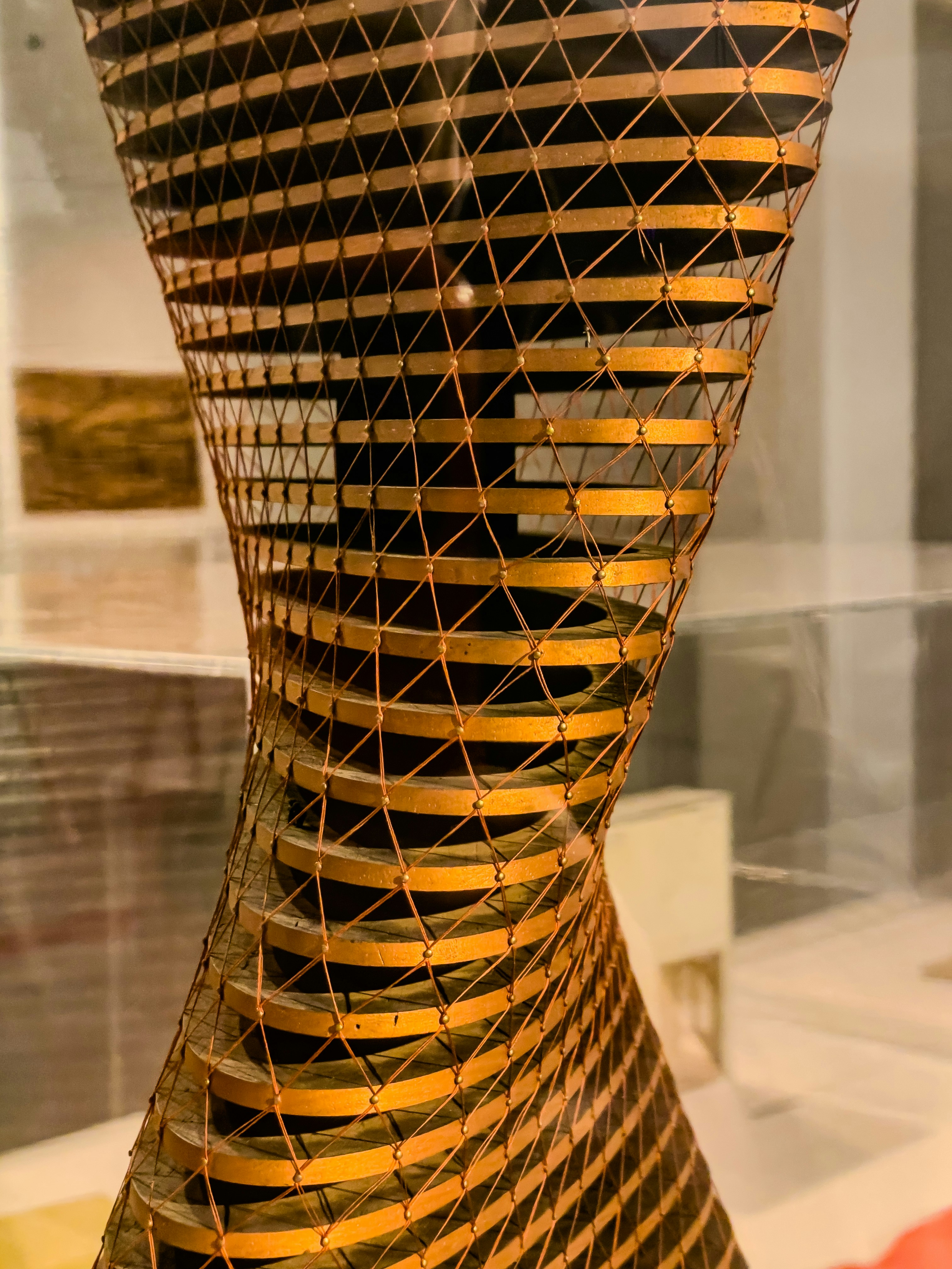 Copper Lattice Twirl: A Sculptural Vortex in Mesh and Light