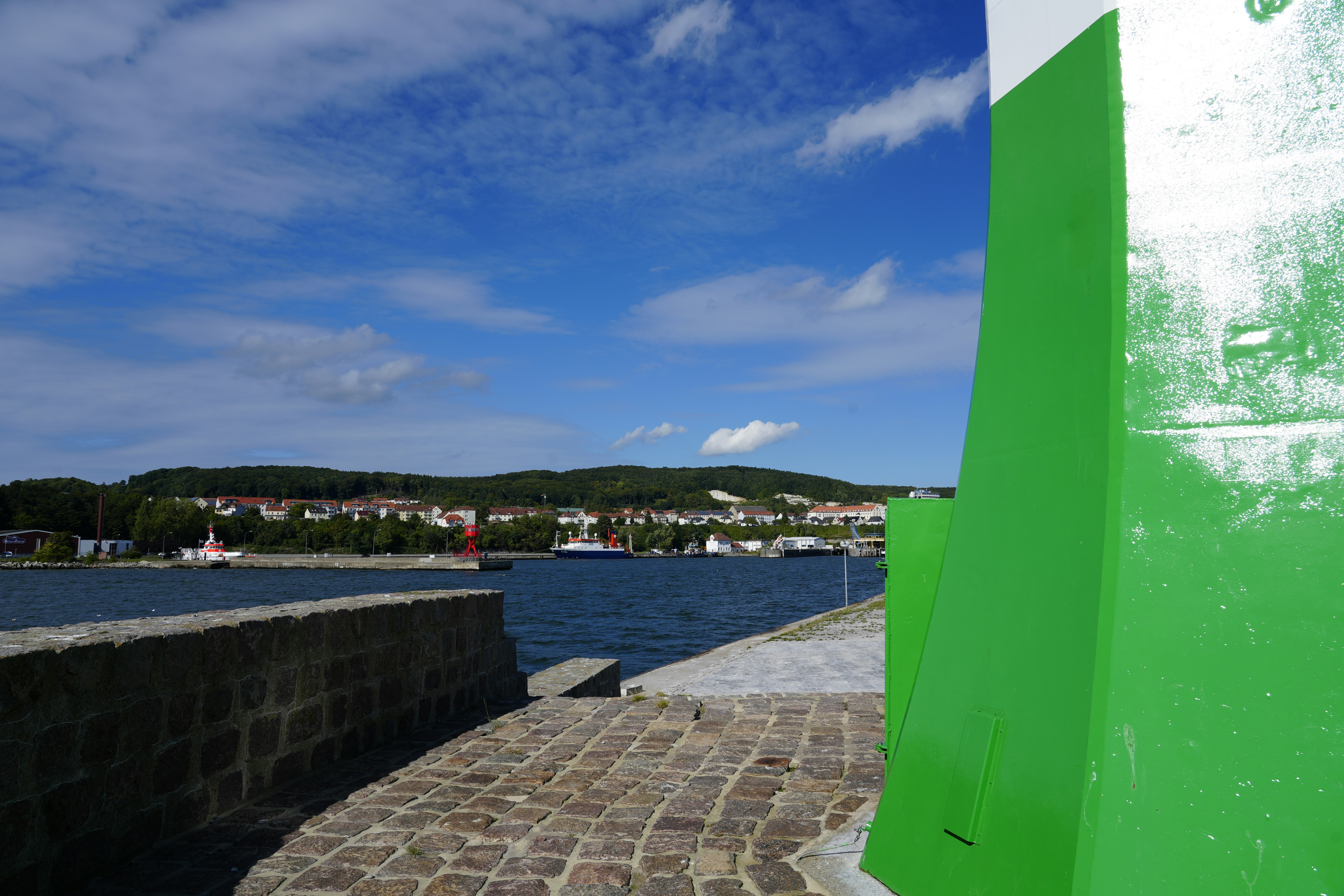 Bright Green Harbor: A Windowed View Along the Quay