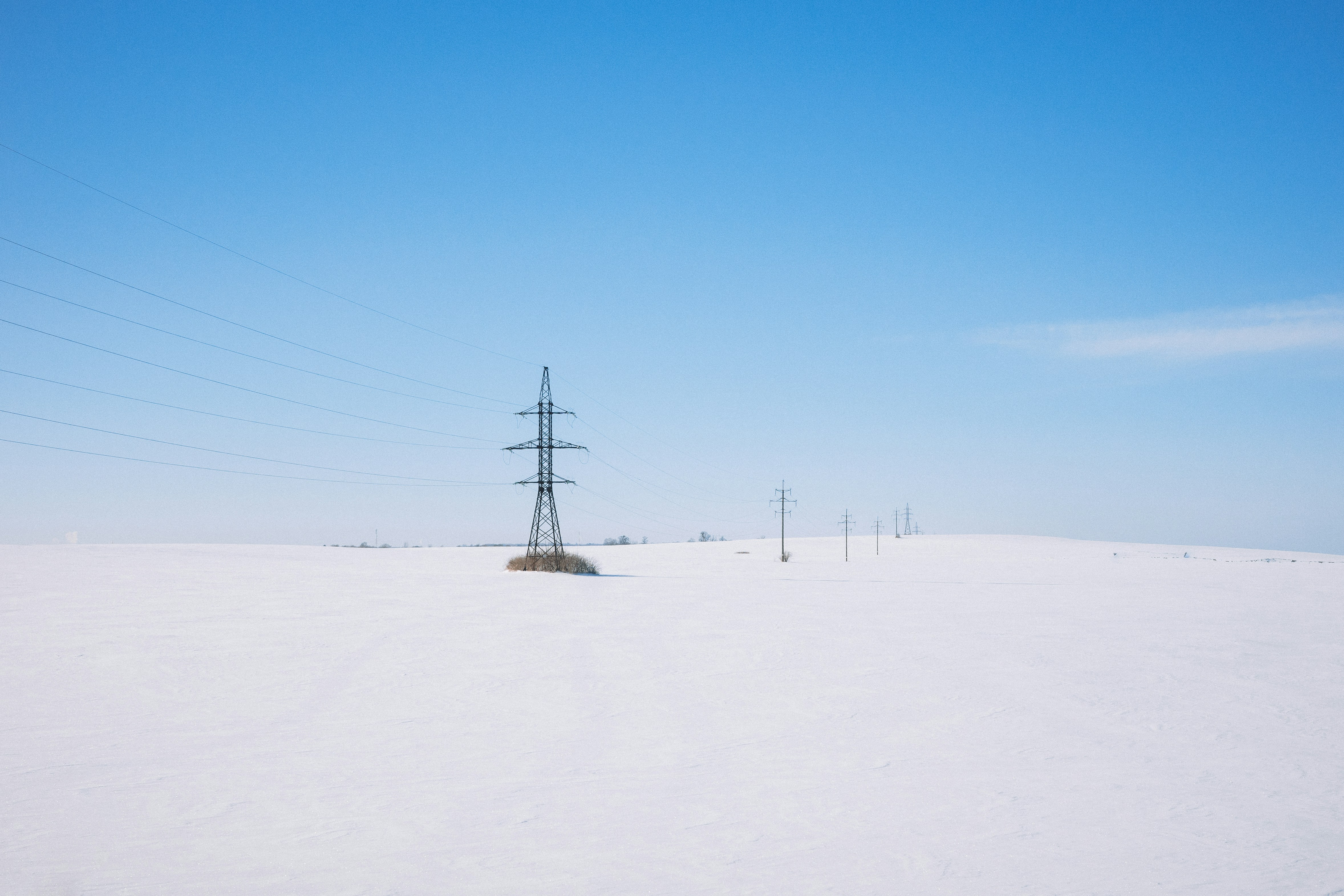 Power Lines Across a Quiet Snowfield