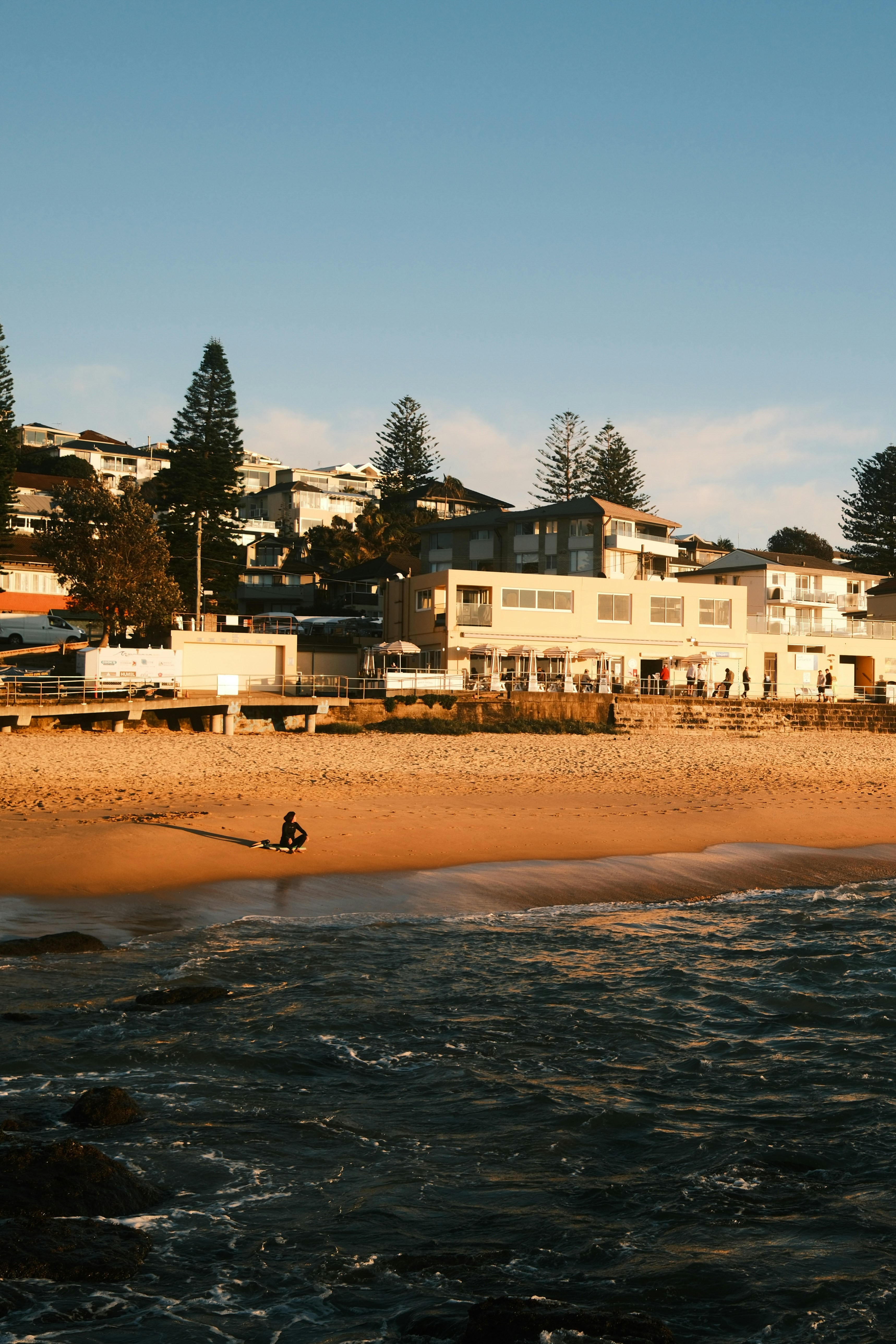 Coastal Homes and Quiet Beach: Sunset Light on the Seaside Village