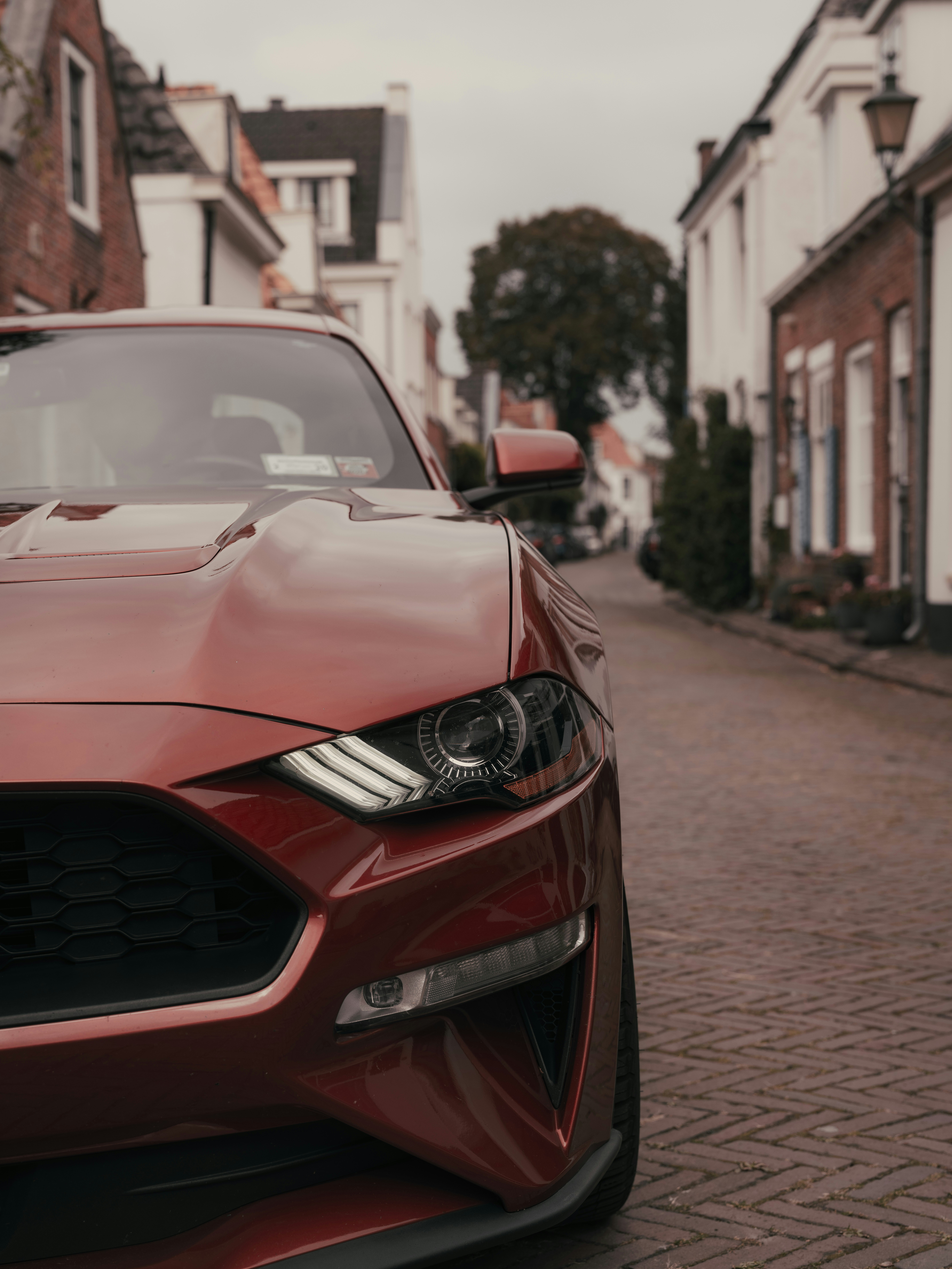 Red Street Sentinel: A Ford of Steel on a Quiet City Lane