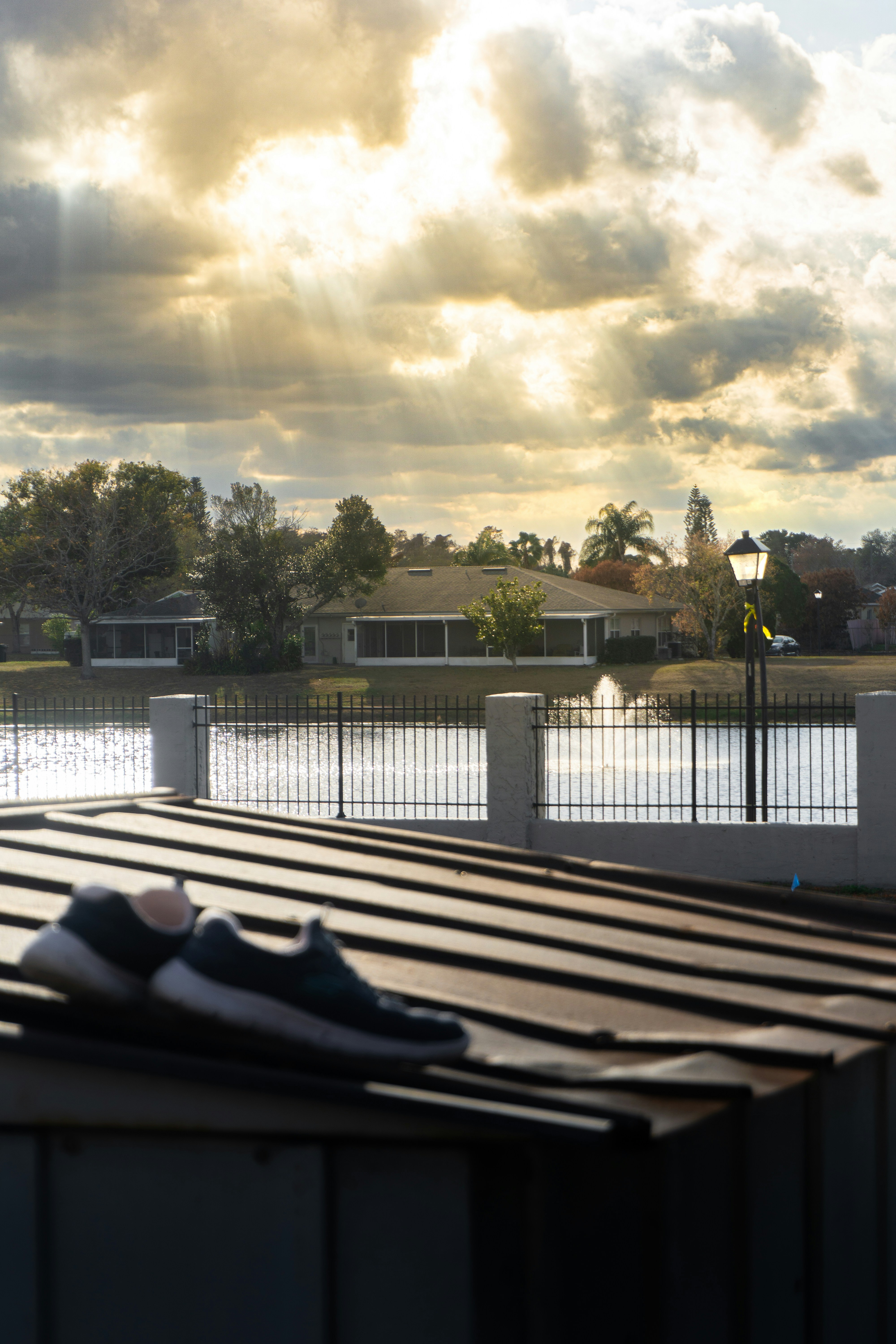 Sunrise Over Quiet Lake: Shoes in the Foreground