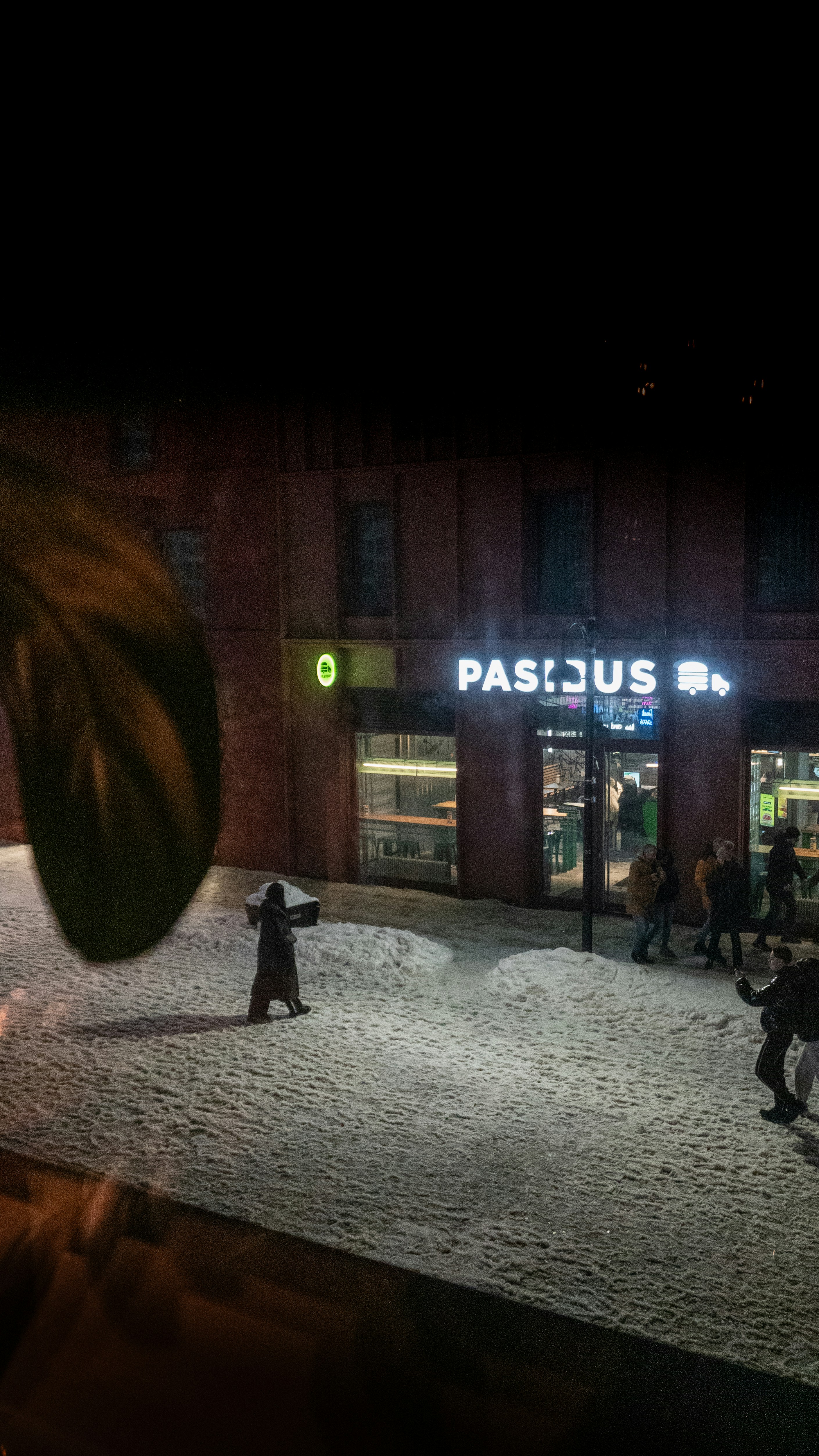 Night Streetfront: Snow, Neon, and Footsteps by PASILIS